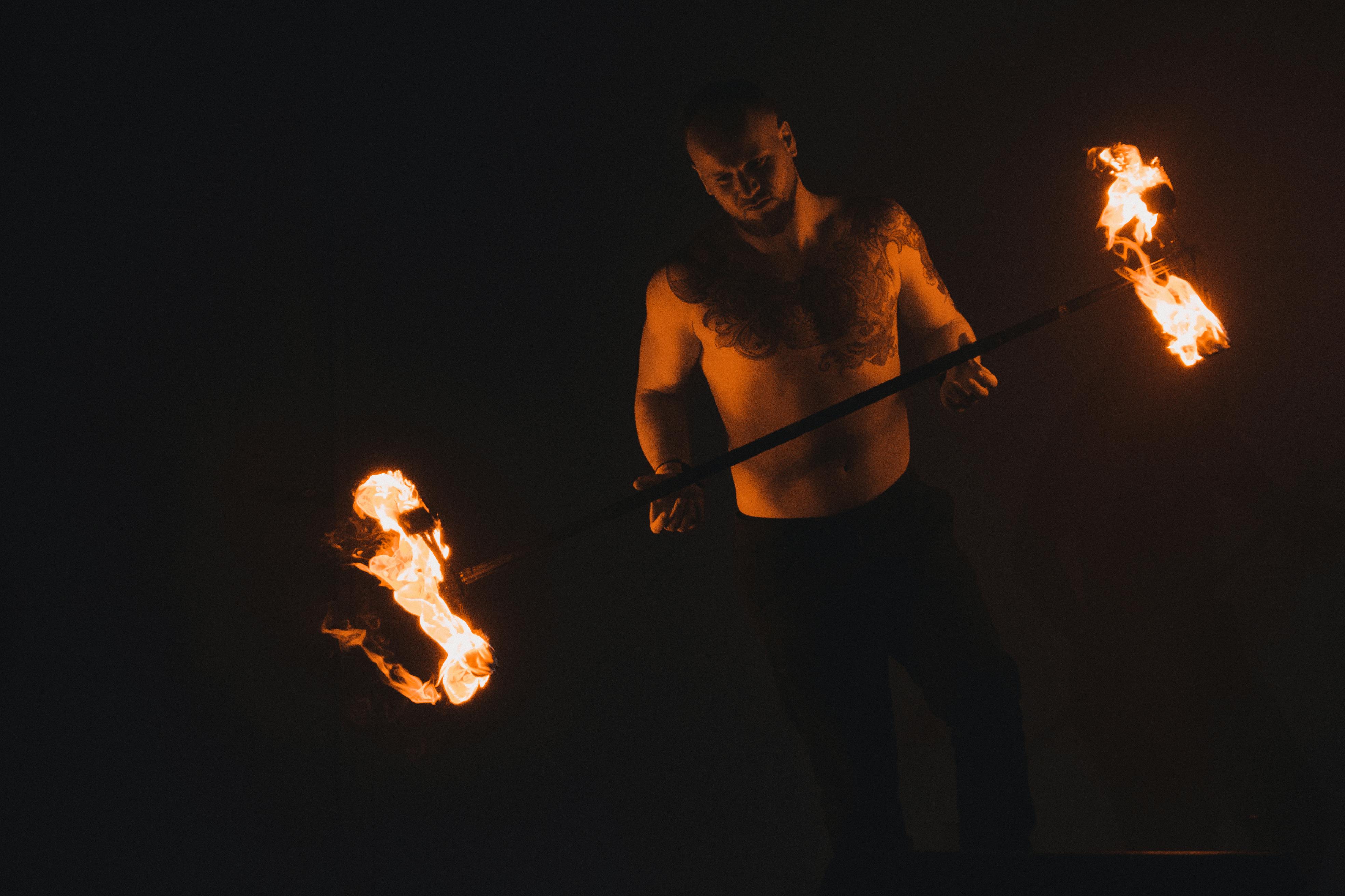 Man Performing with Fire on Stage · Free Stock Photo