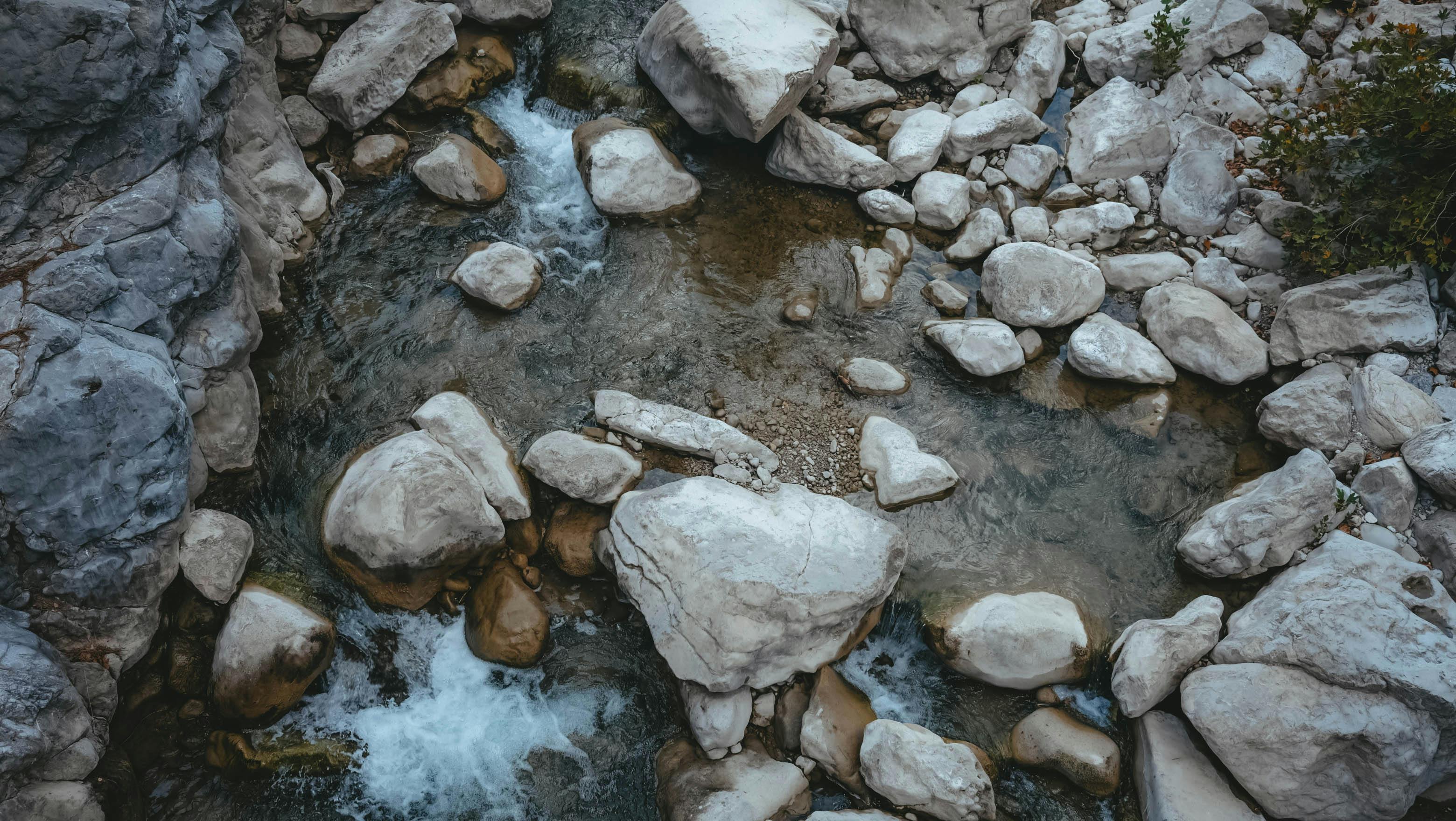 A River Streaming Through the Rocks · Free Stock Photo