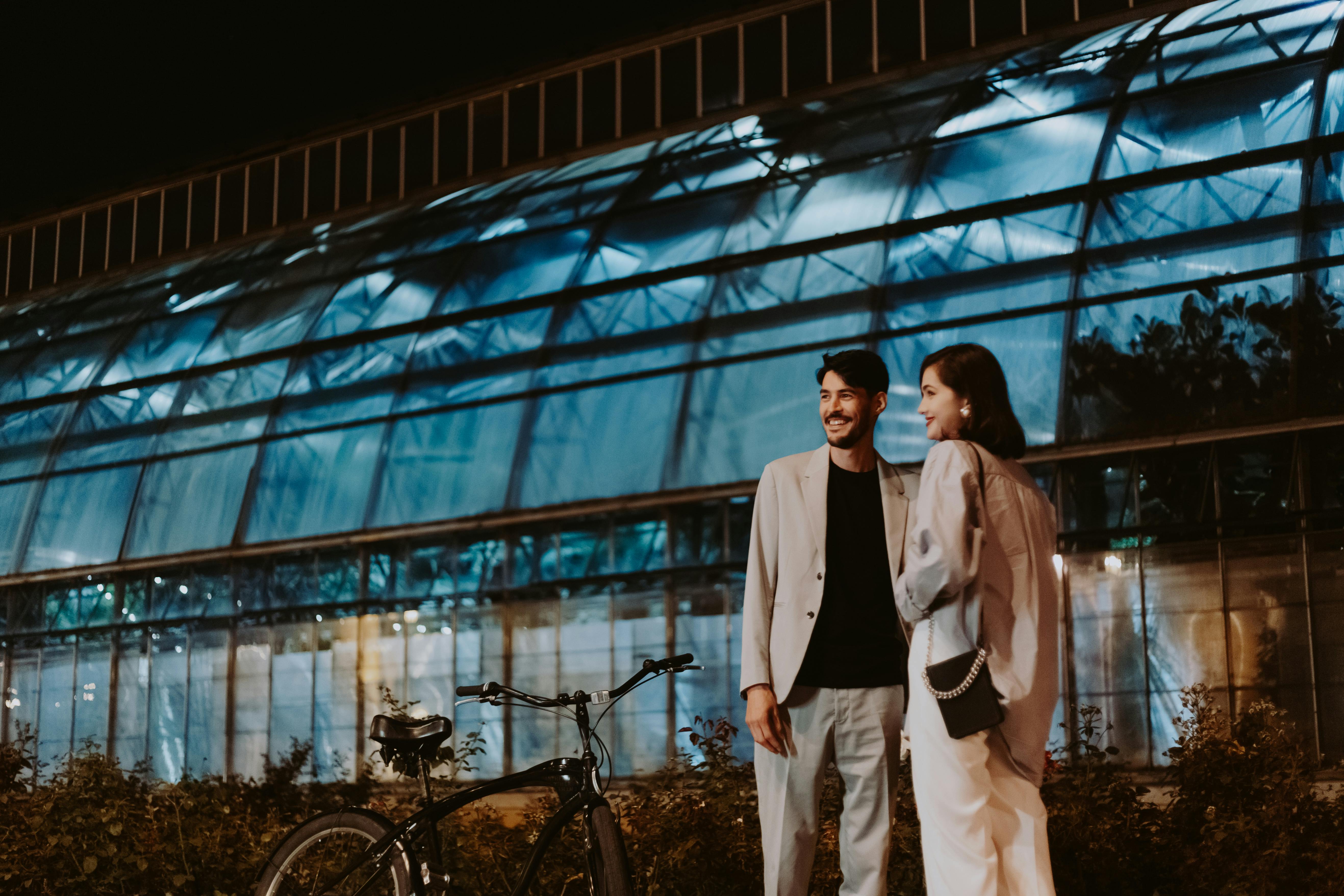 A Couple Standing on the Street During Night Time · Free Stock Photo