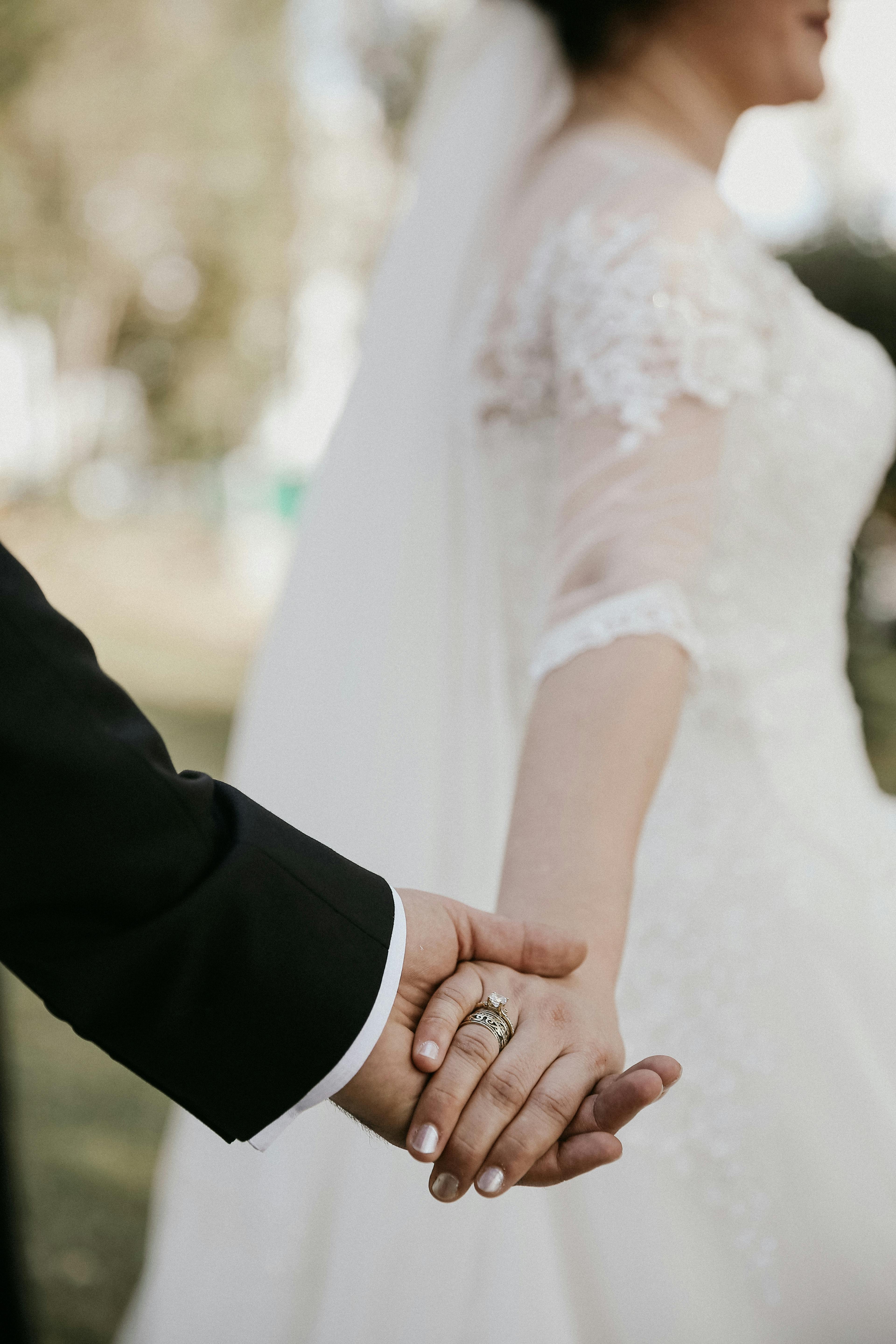 Man in Suit Dropping Wedding Rings · Free Stock Photo