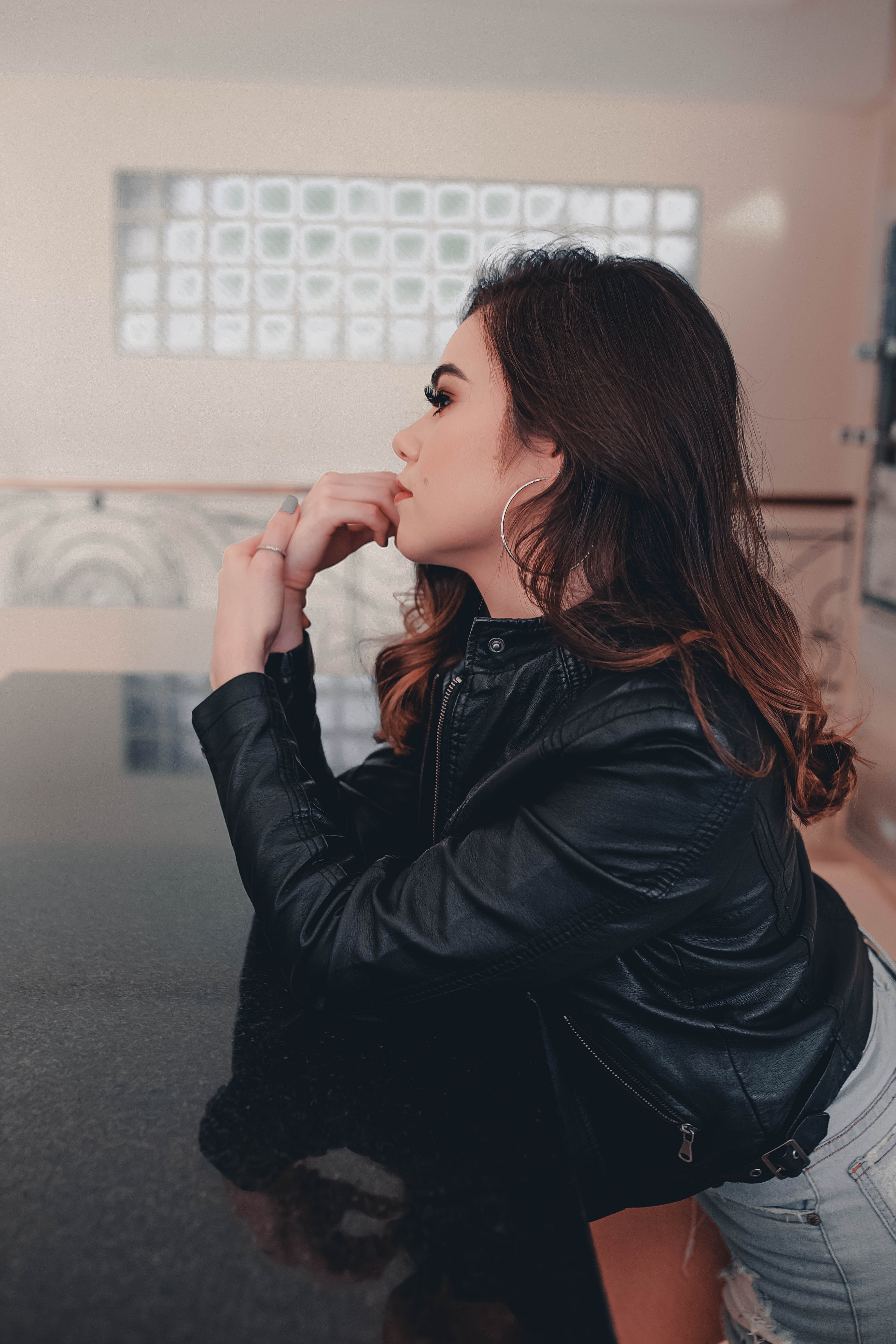 A Side View of a Woman in Black Leather Jacket · Free Stock Photo