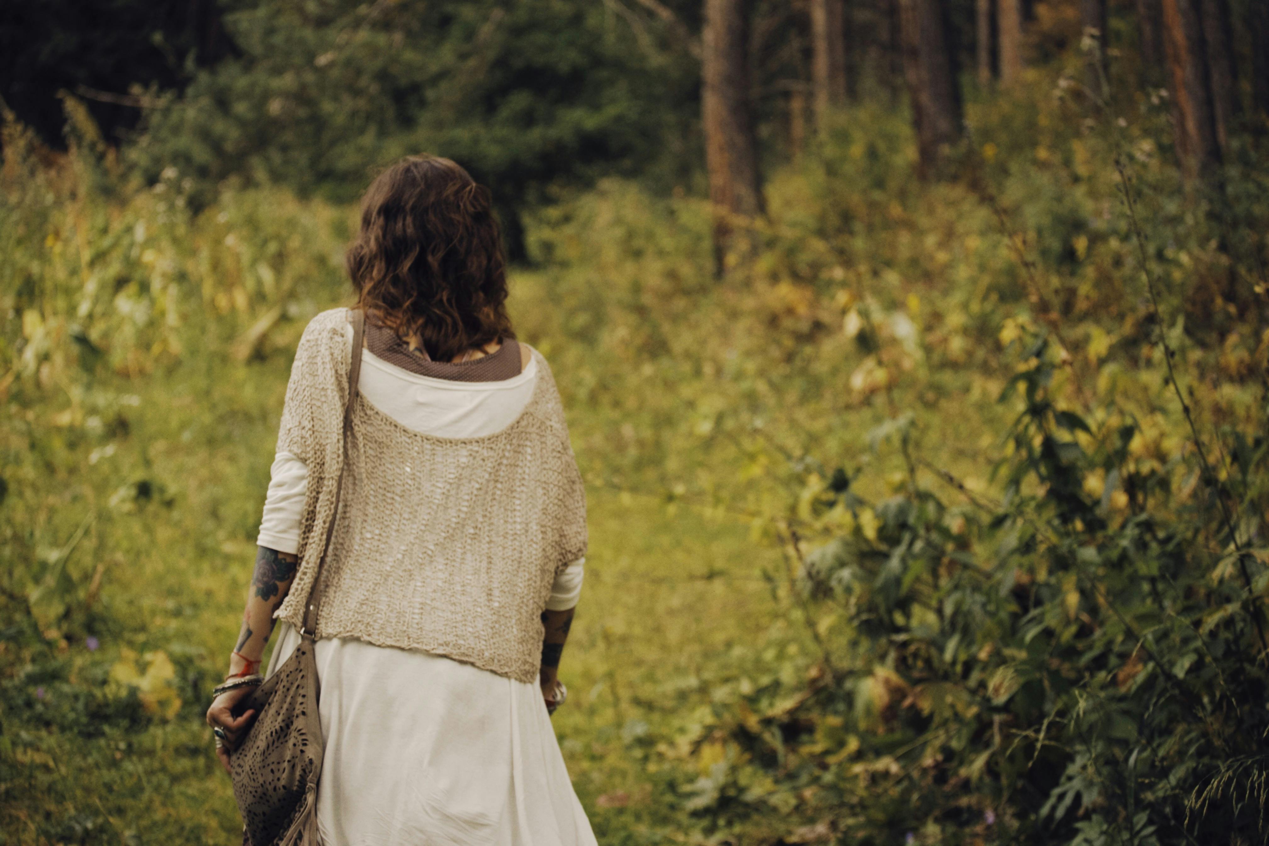 Back View of a Woman Walking in the Woods · Free Stock Photo