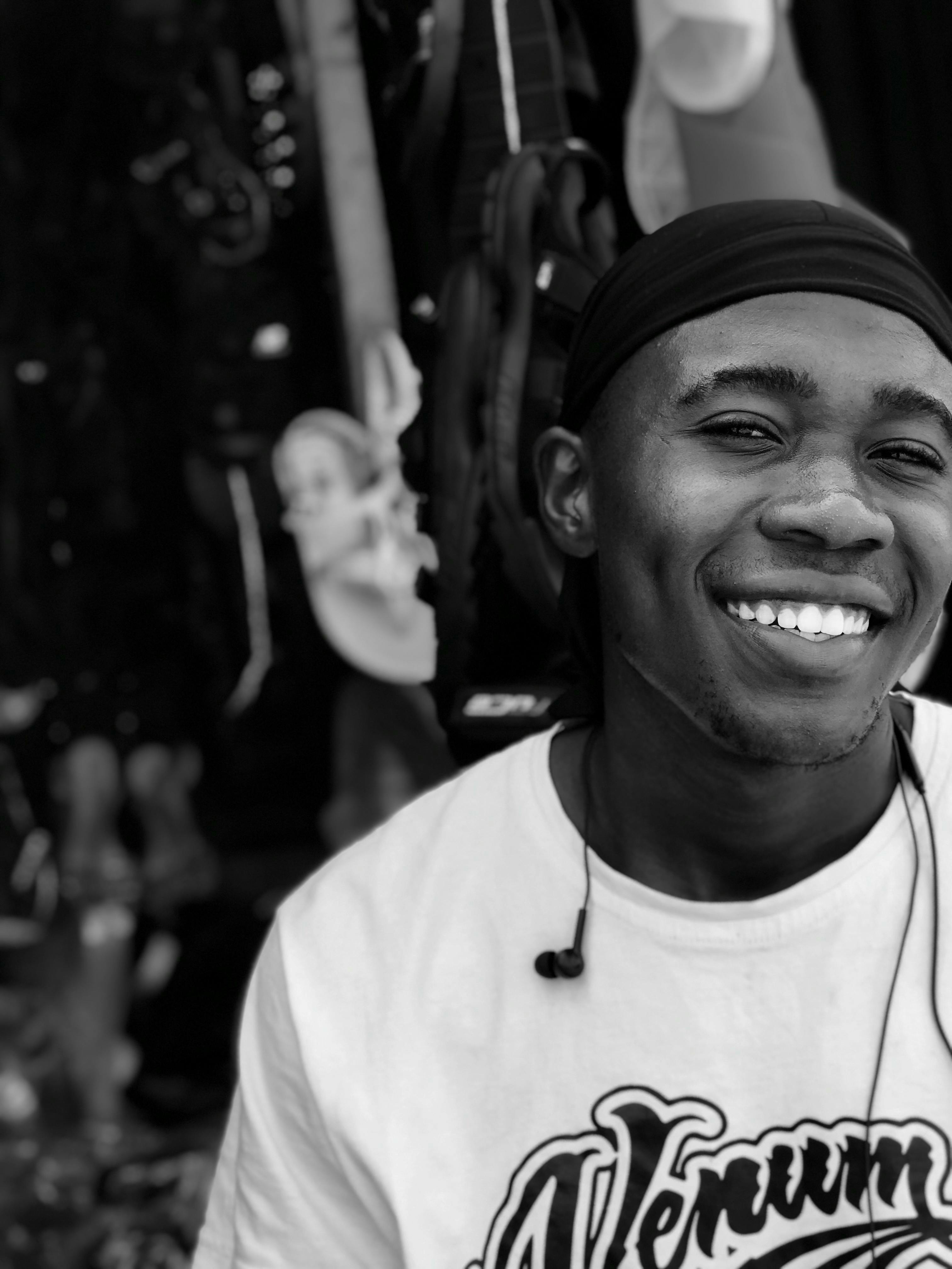 Grayscale Photo of Man Holding his Neck · Free Stock Photo