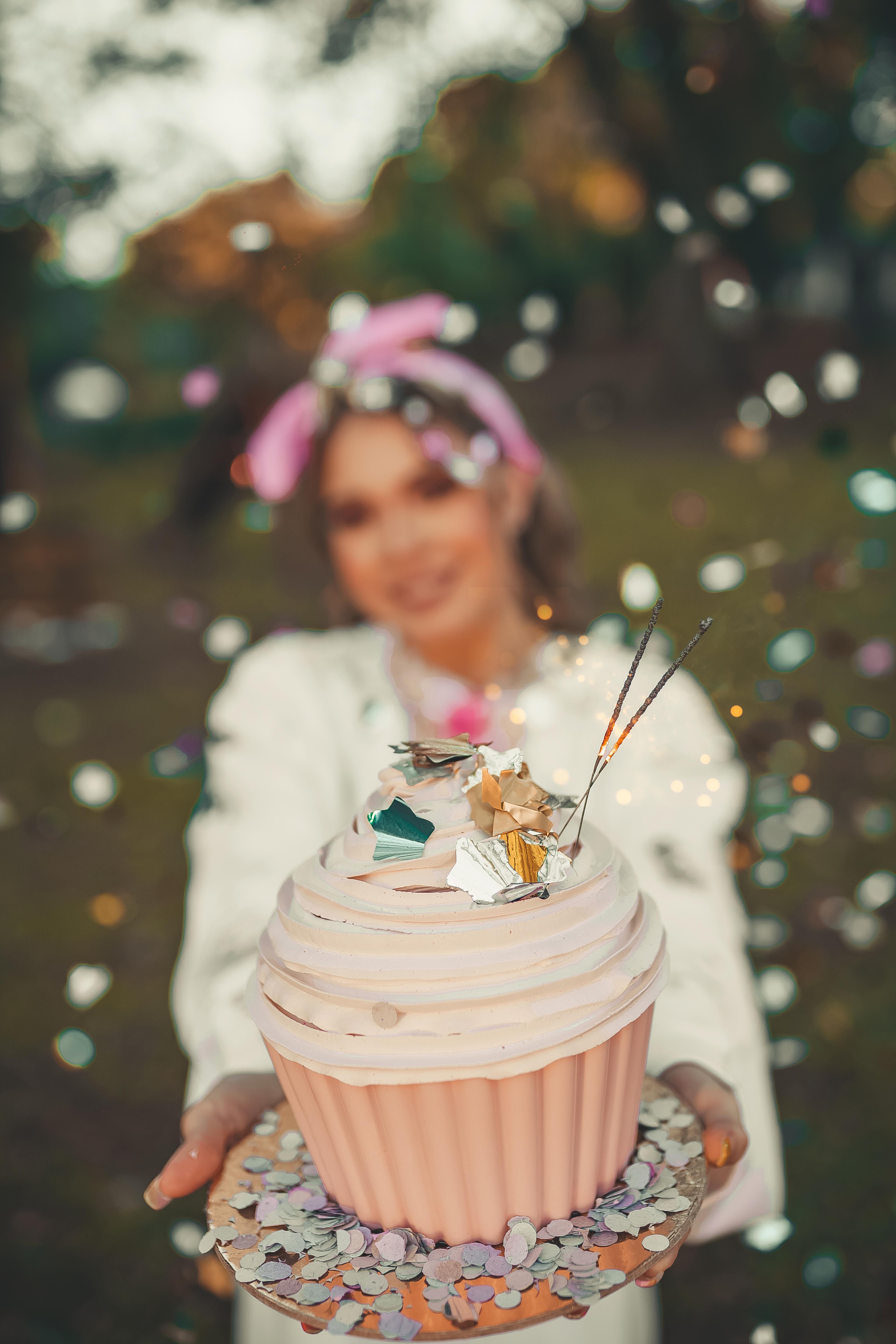 Selective Focus Photo of Cake held by a Woman · Free Stock Photo