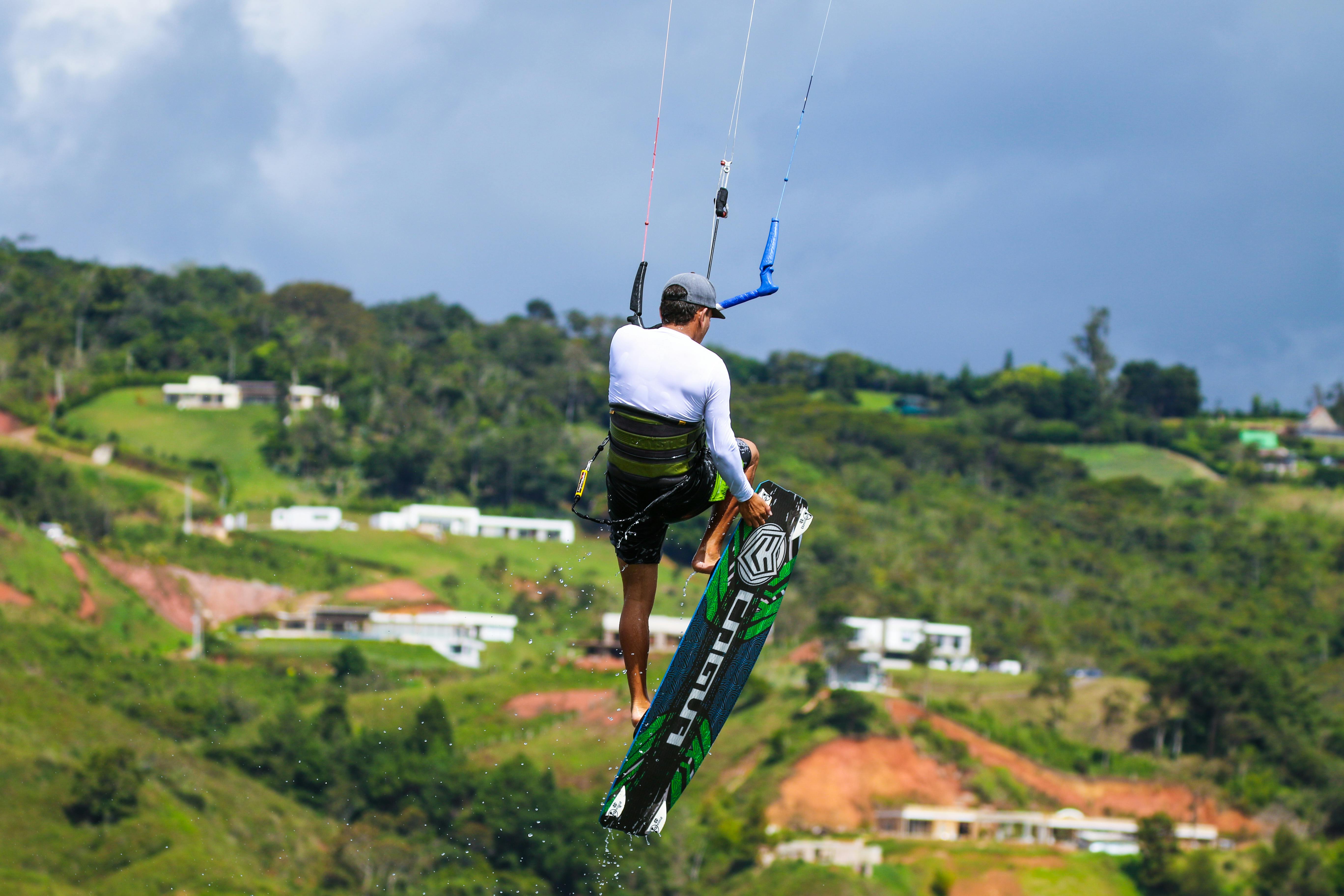 Man Lifted in Air during Kitesurfing · Free Stock Photo