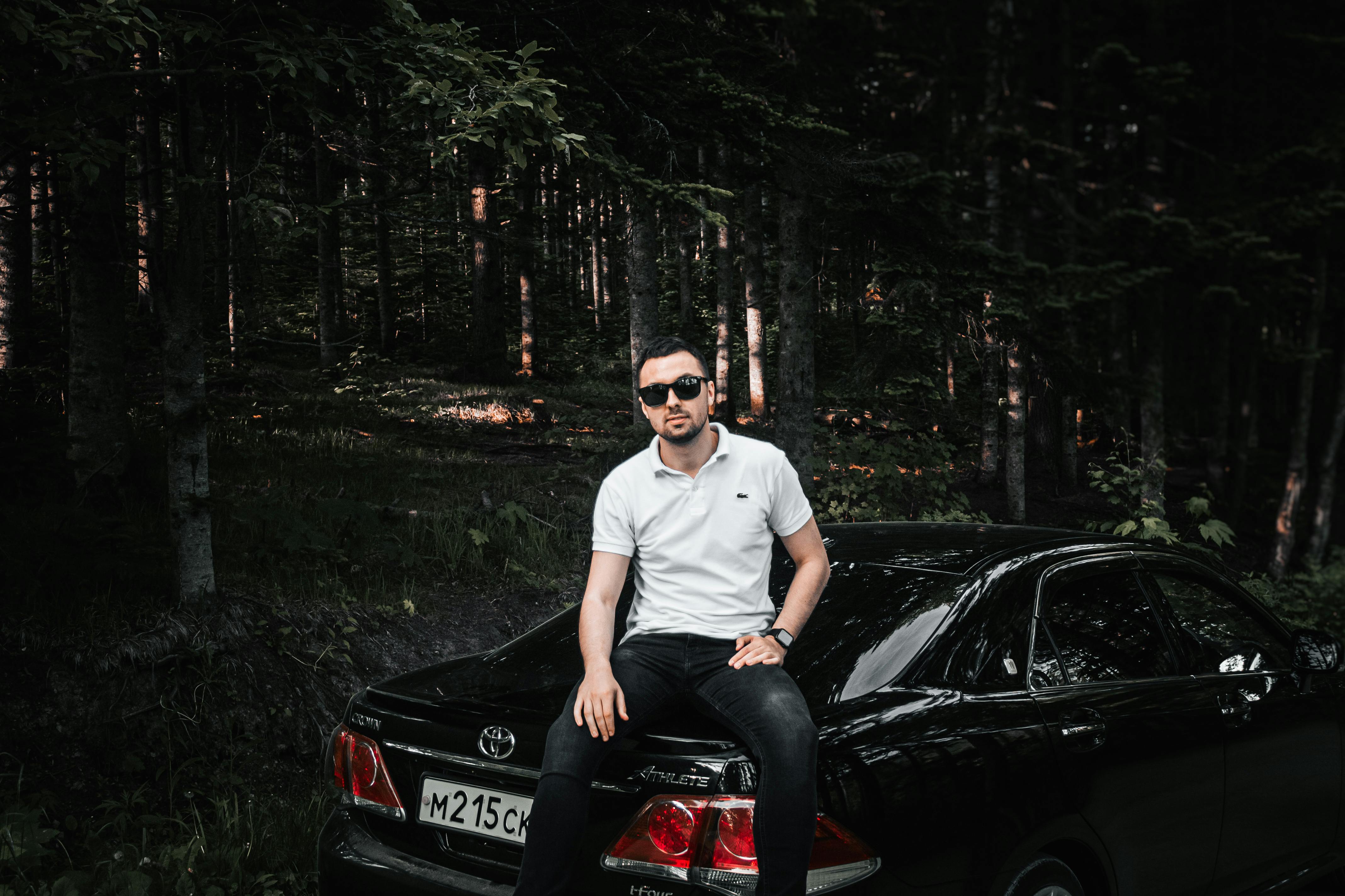 Man Sitting in His White Car · Free Stock Photo