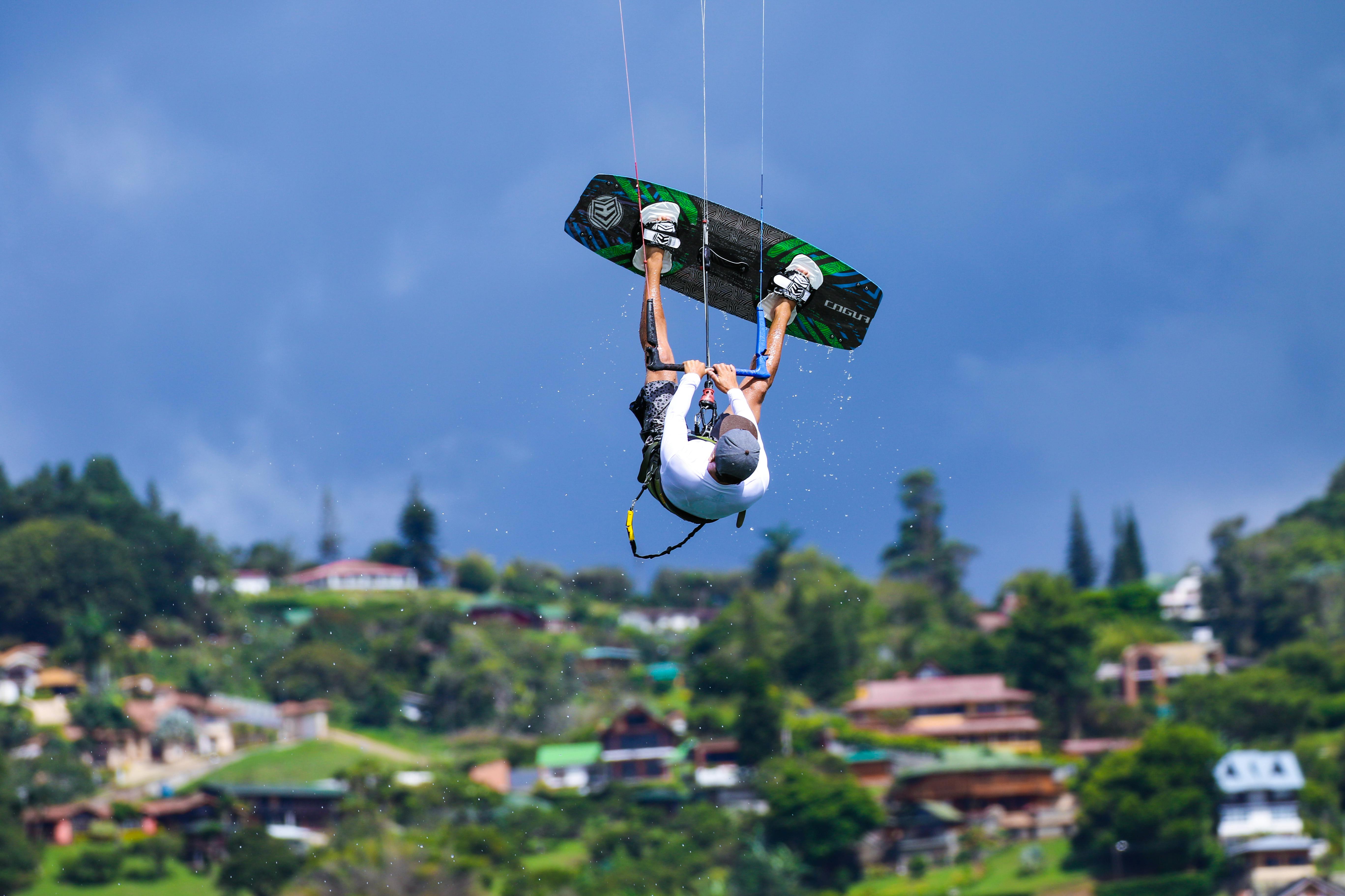 Man Lifted in Air during Kitesurfing · Free Stock Photo