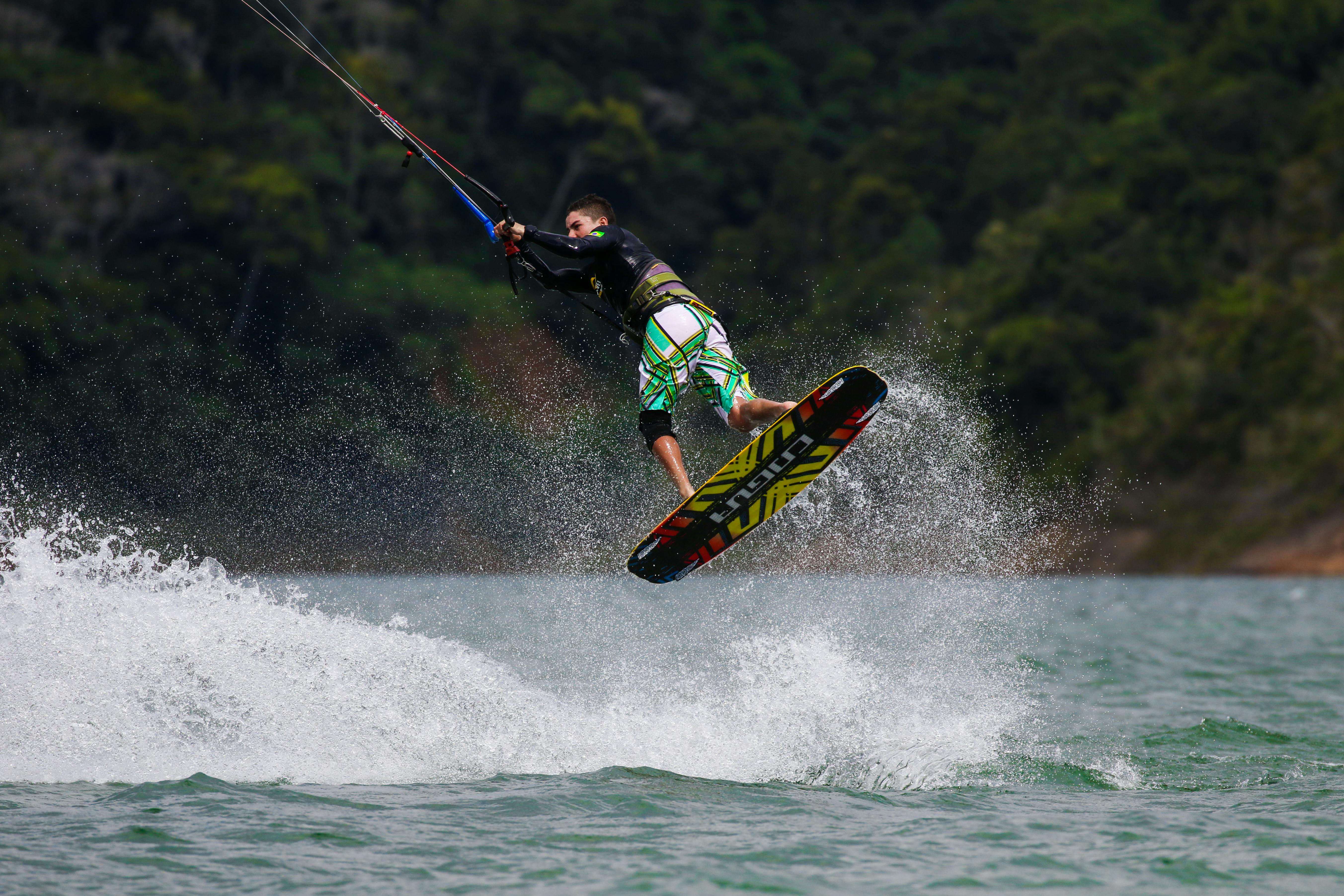 Person on Body of Water Kitesurfing · Free Stock Photo