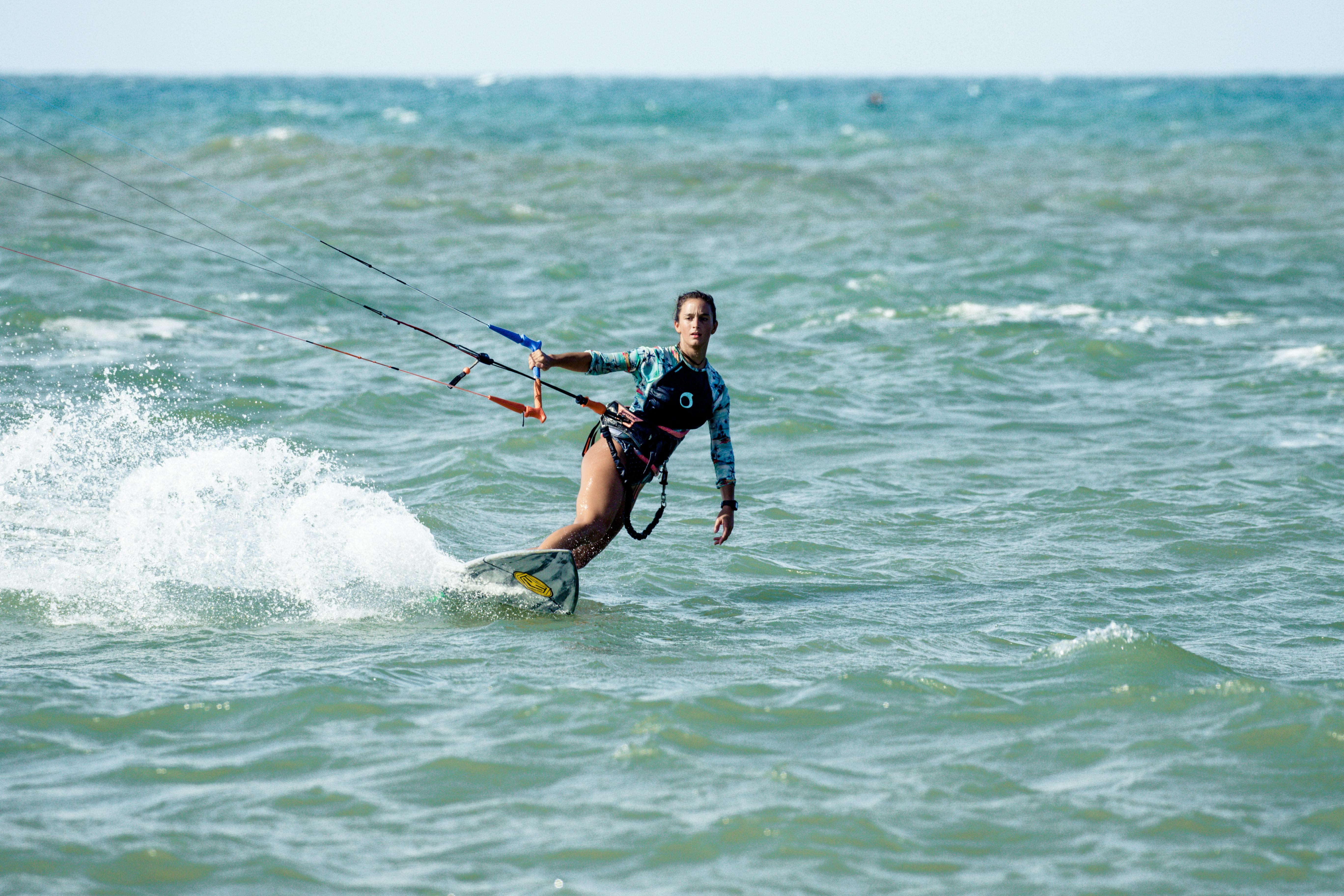 Woman Kitesurfing in the Sea · Free Stock Photo