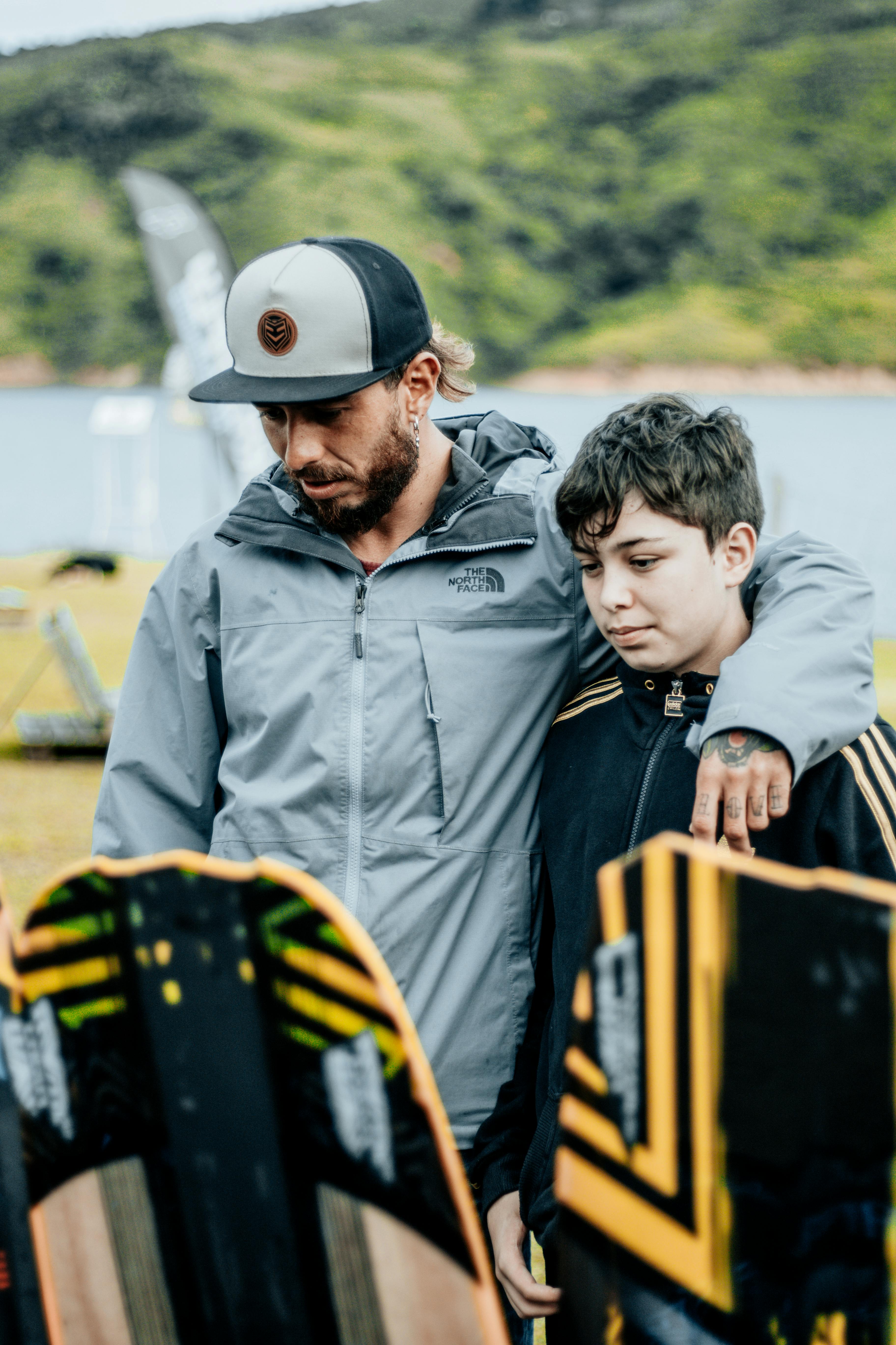 A Father Carrying His Son in the Air · Free Stock Photo