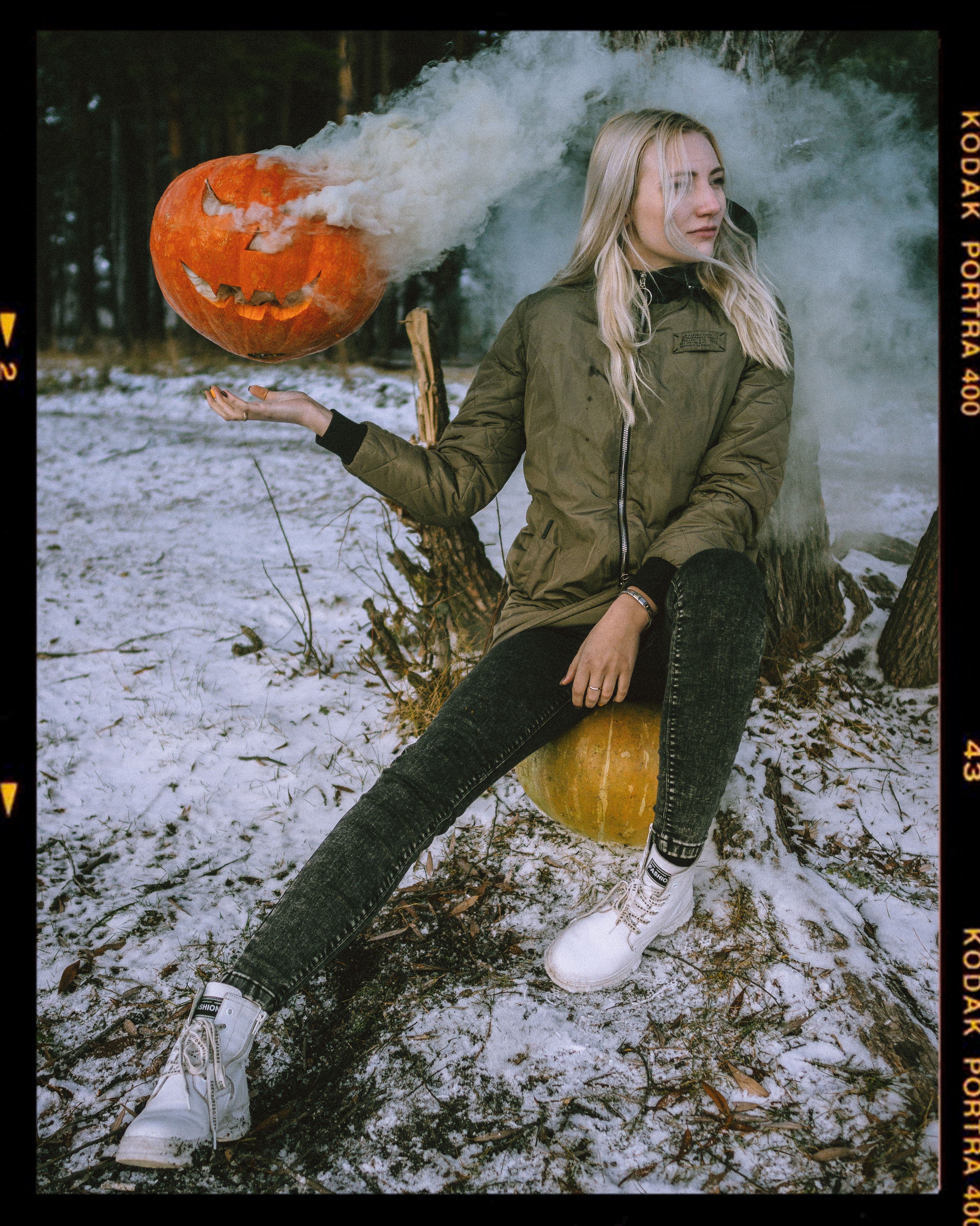 Woman Sitting with Smoking Pumpkin · Free Stock Photo
