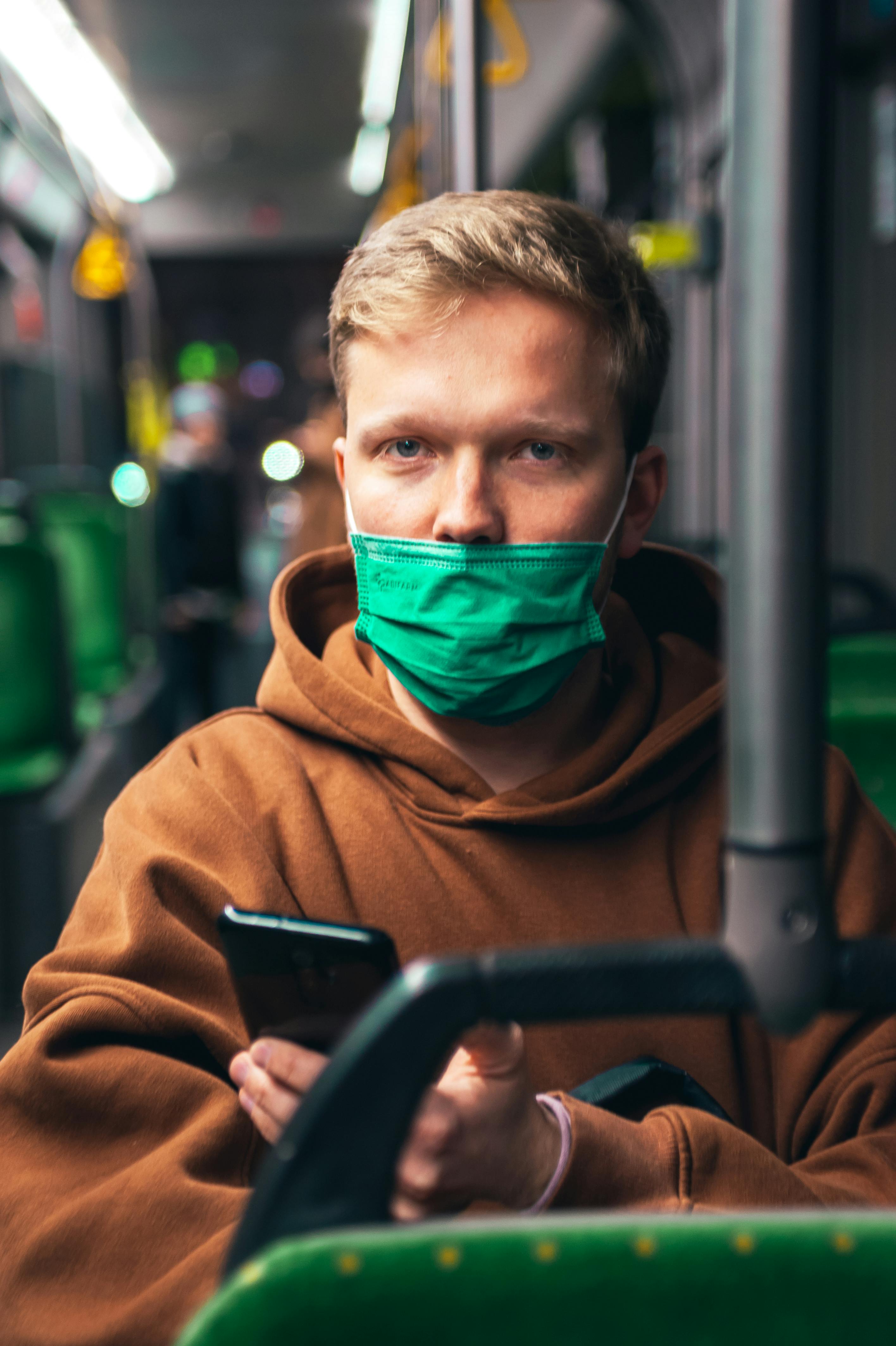 Man Wearing Face Mask under his Nose in Public Transportation · Free ...