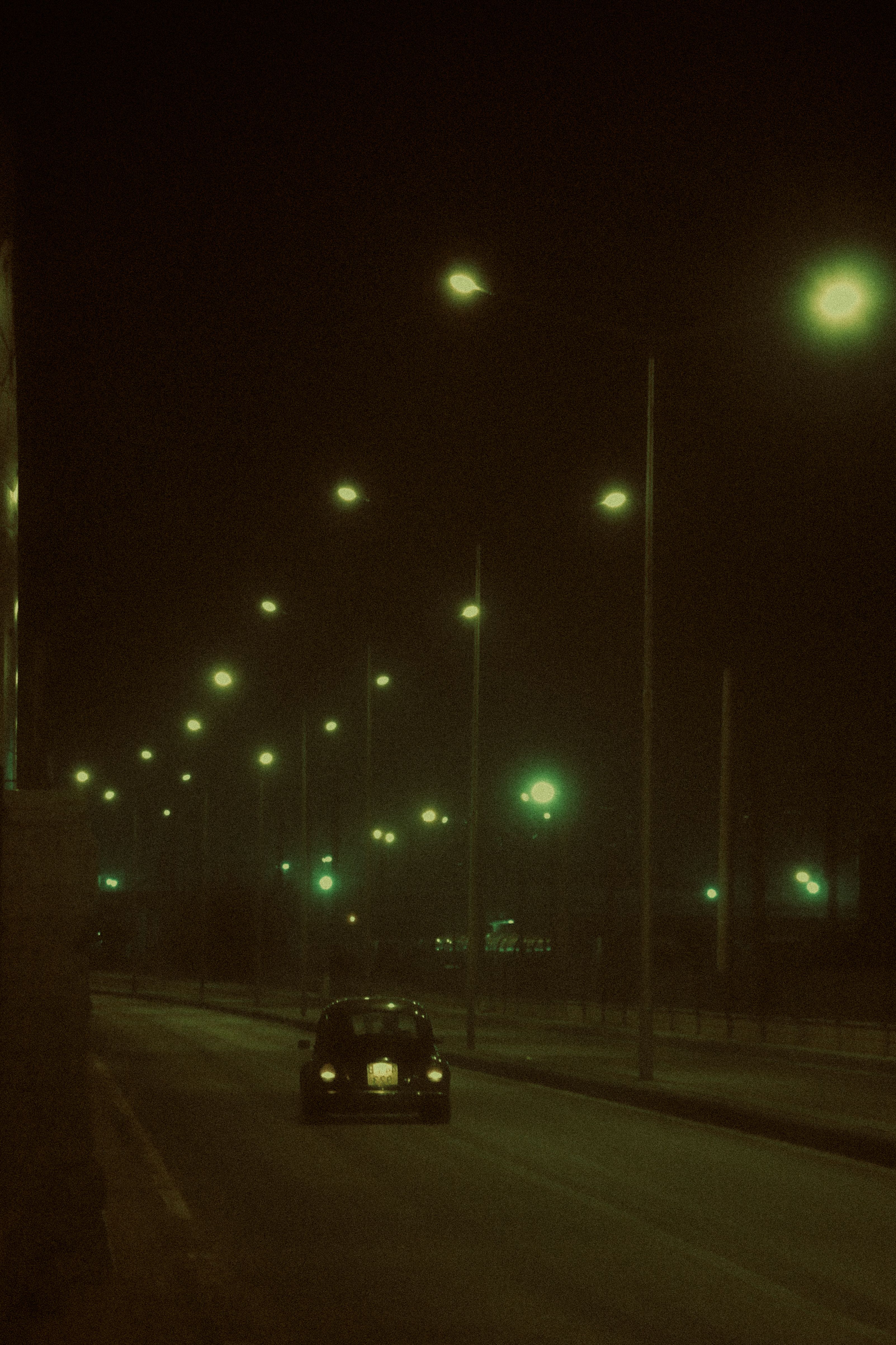 Car on Illuminated Street · Free Stock Photo