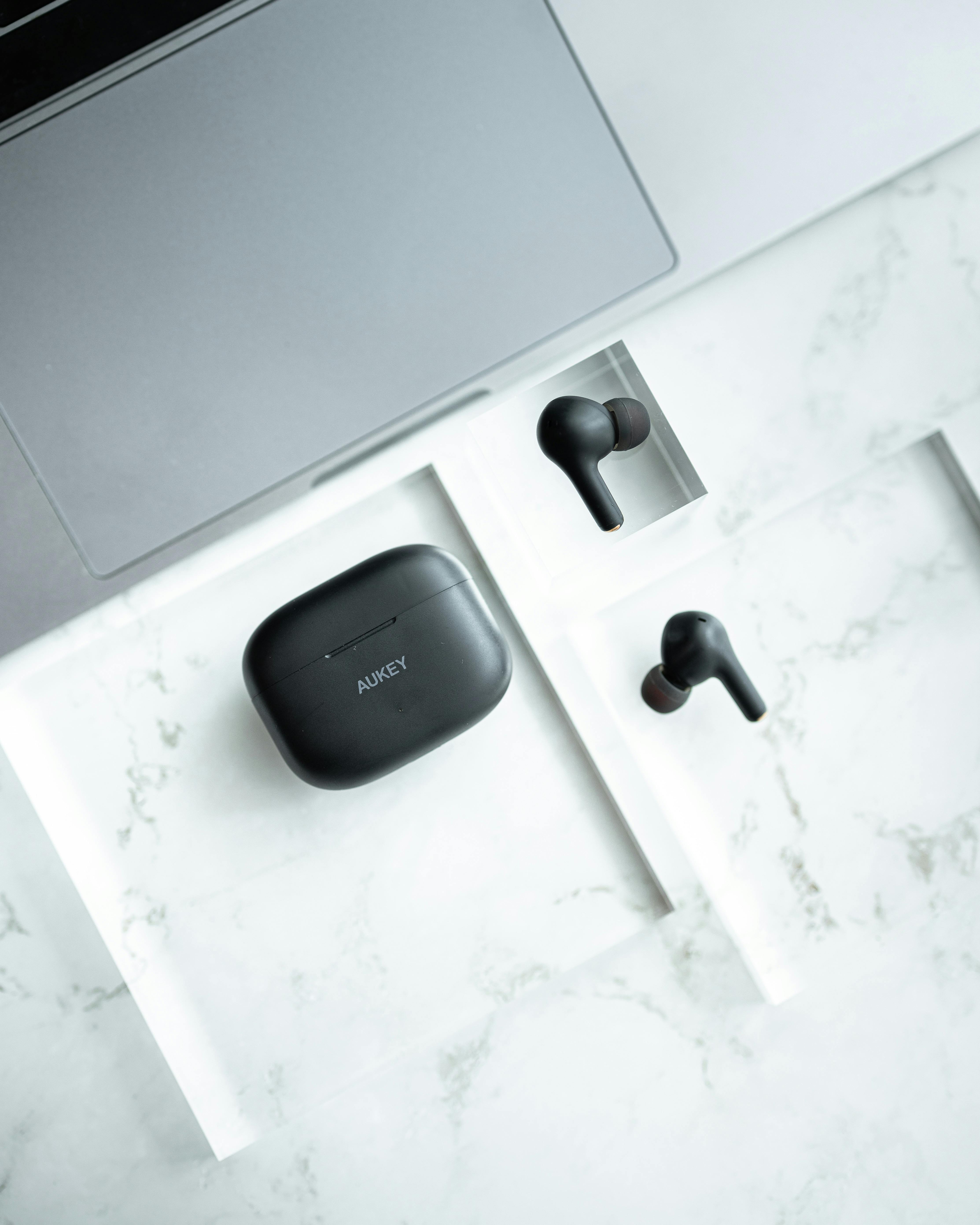 Earpiece Set on a White Background · Free Stock Photo