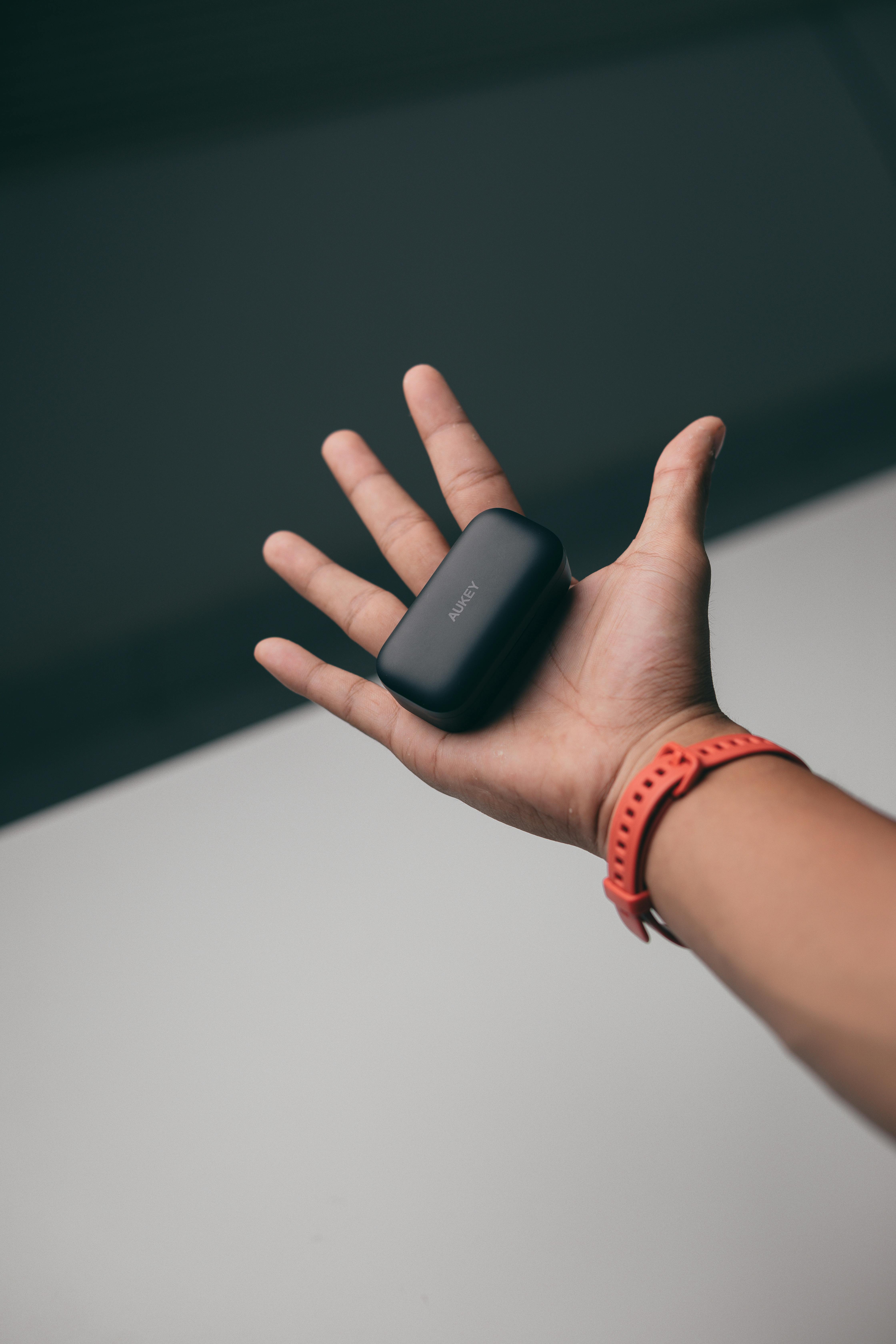 Photograph of a Black Case on a Person's Hand · Free Stock Photo