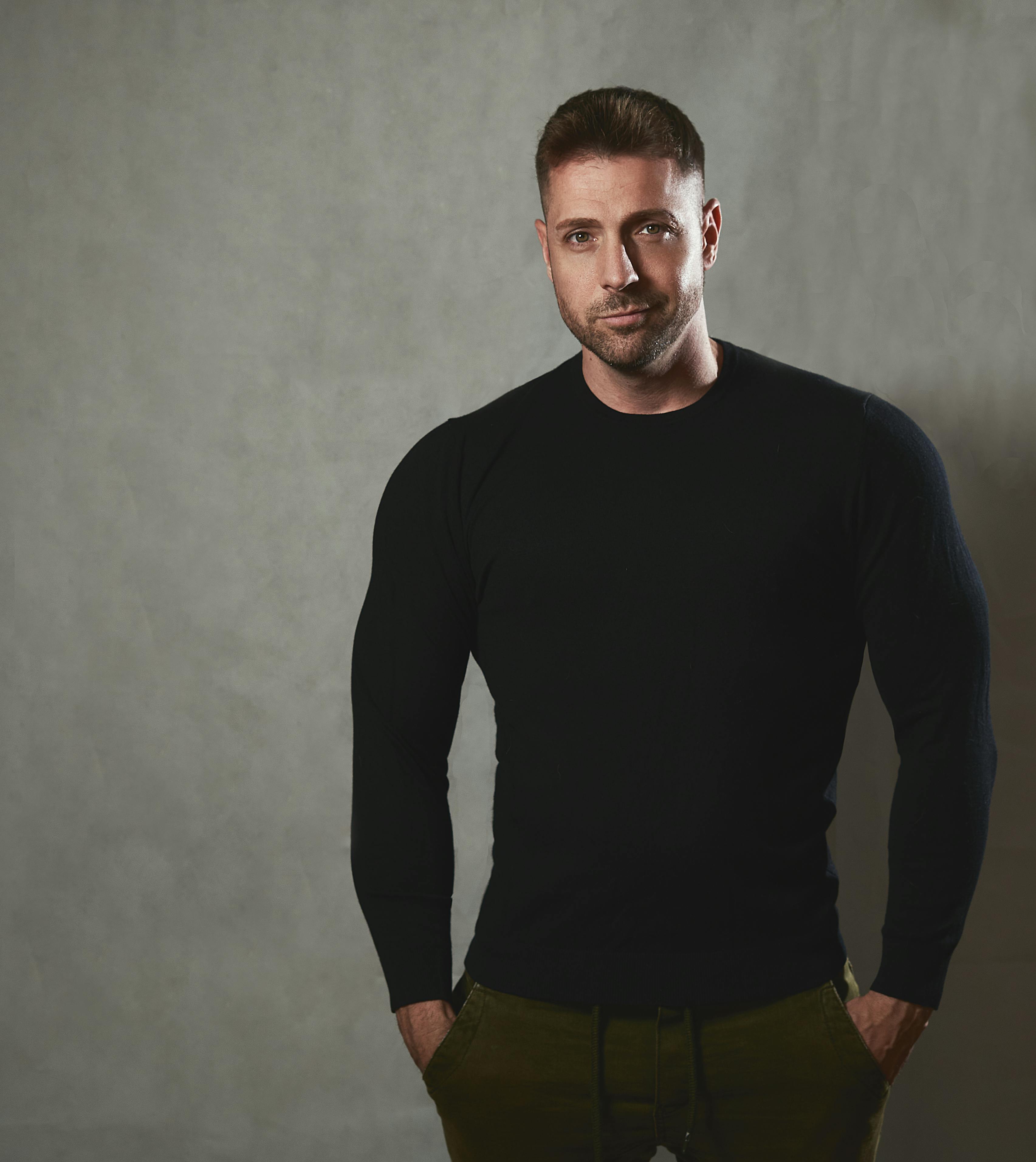 A Brawny Man in Black Long Sleeve Shirt with Facial Hair · Free Stock Photo