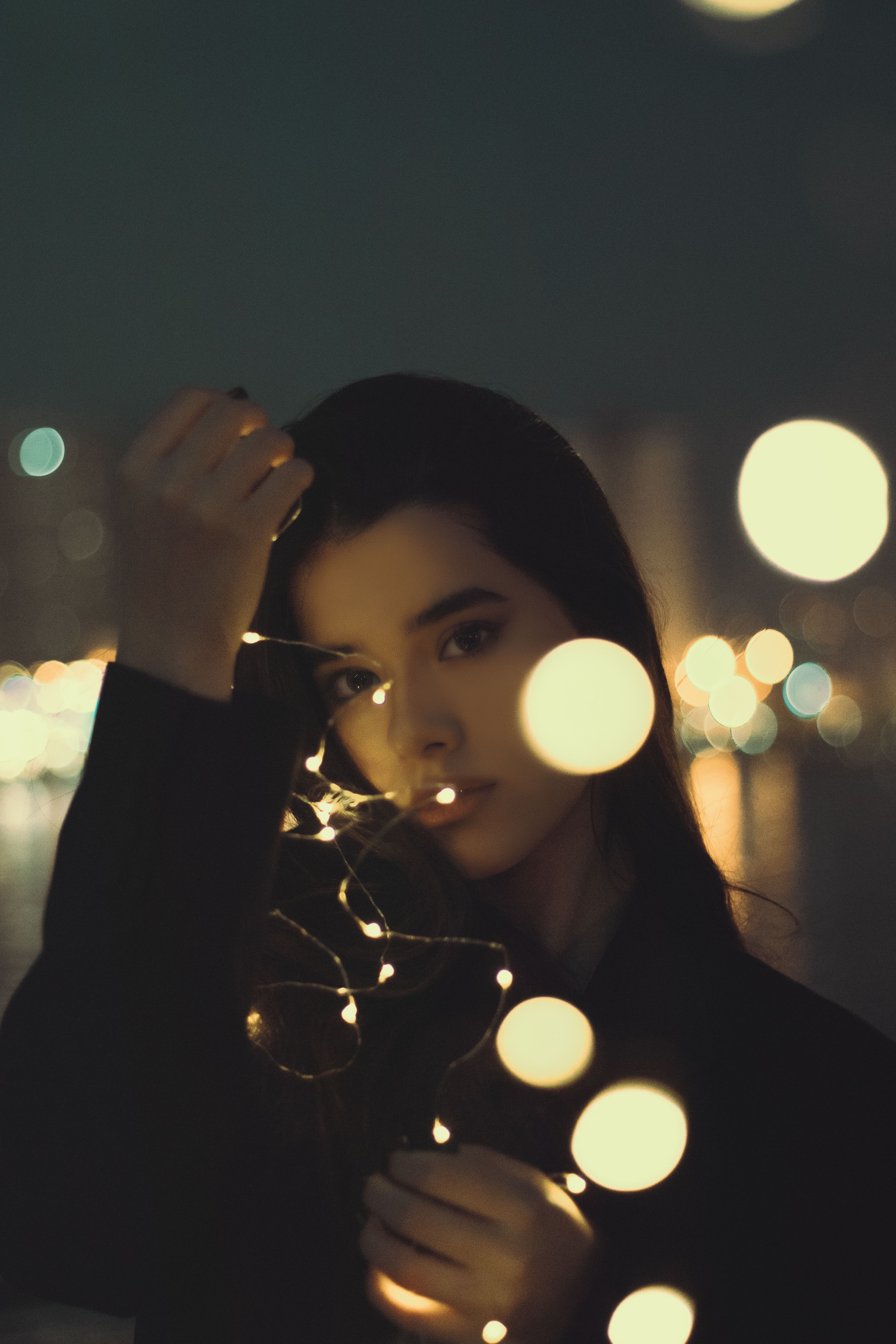 Beautiful Woman Holding String Lights · Free Stock Photo