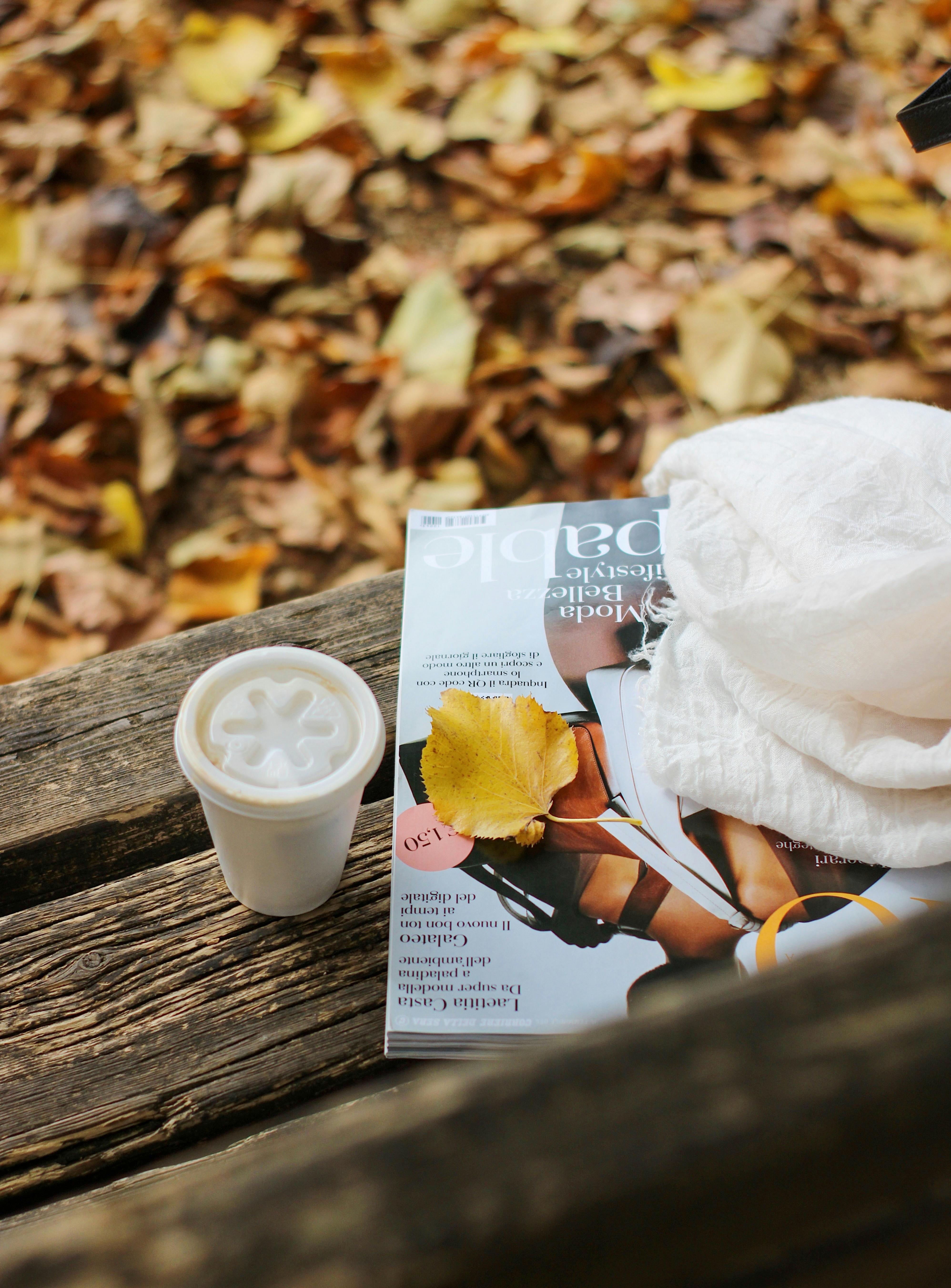 Jug with Beverage by Magazine · Free Stock Photo