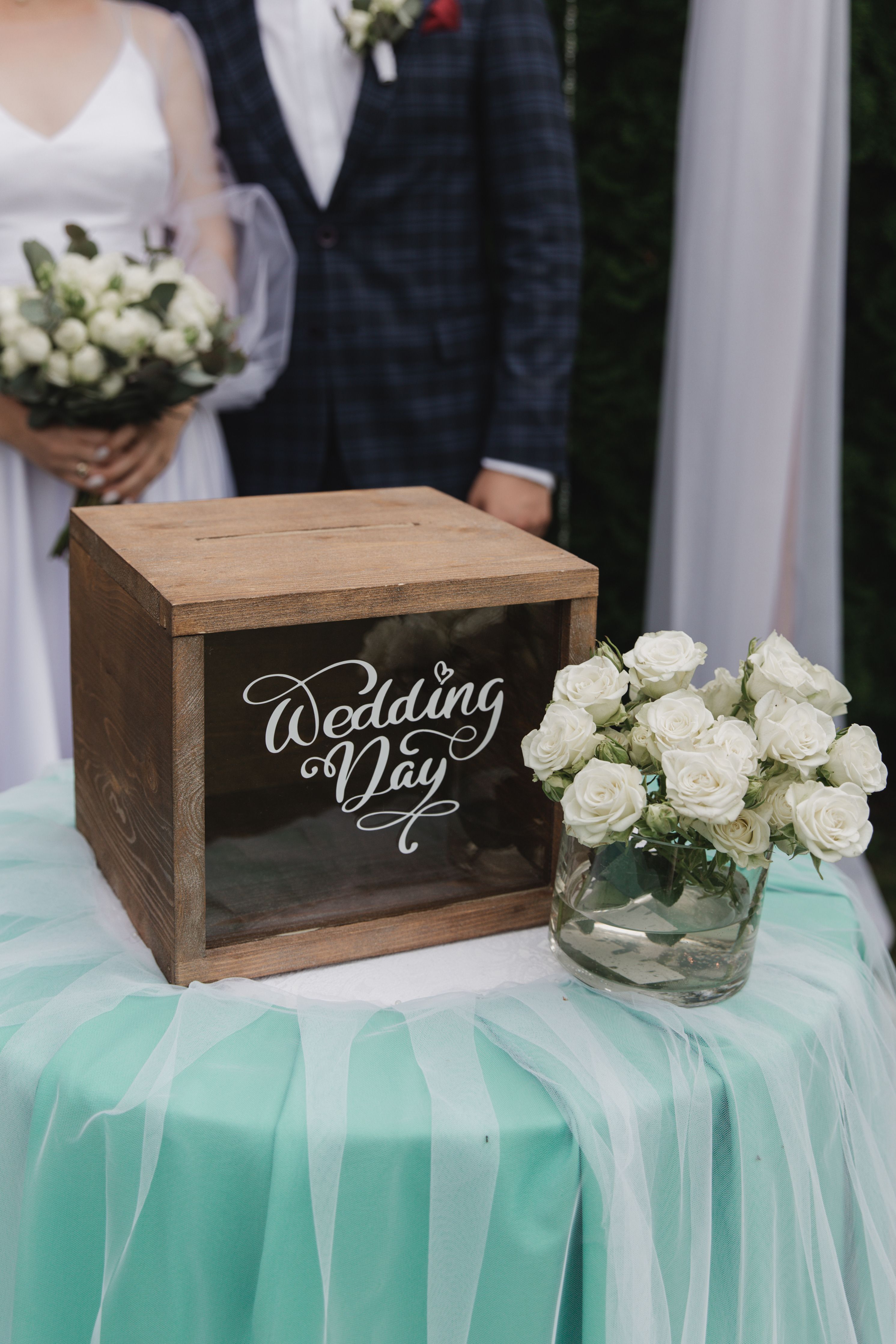 A Box Beside a Bouquet of White Flowers · Free Stock Photo