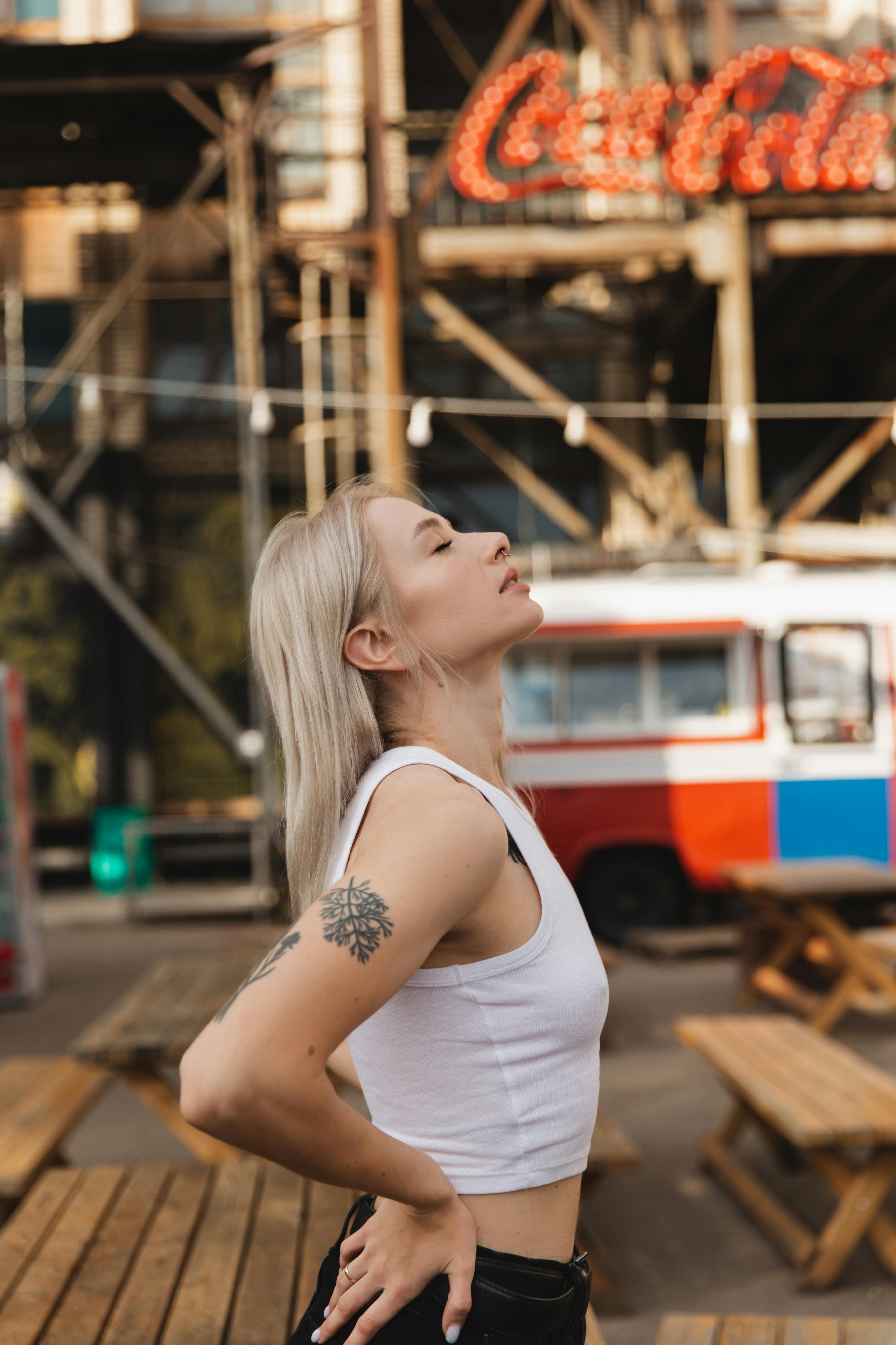 Woman Touching Her Ears While Her Eyes Closed · Free Stock Photo