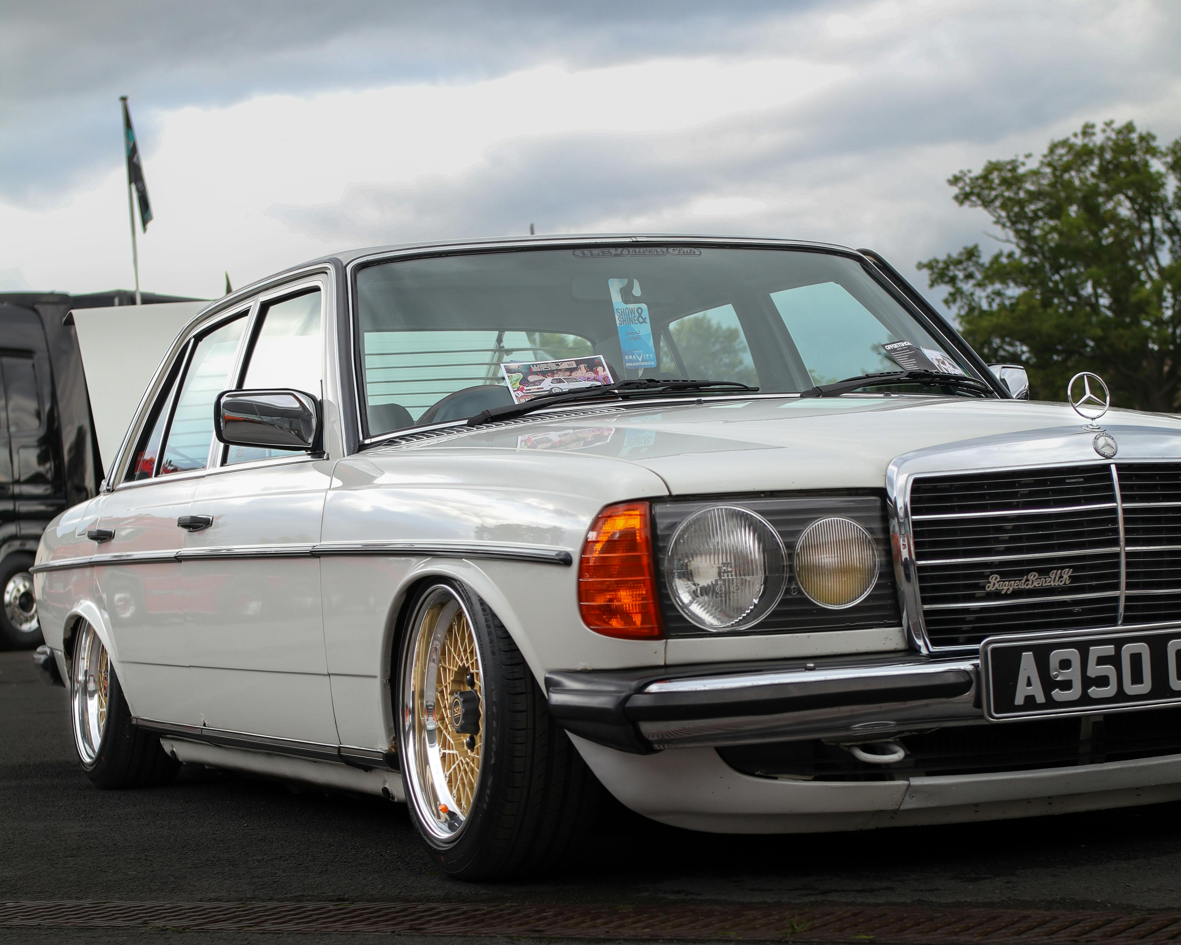 White Mercedes Benz Parked Near Green Tree · Free Stock Photo