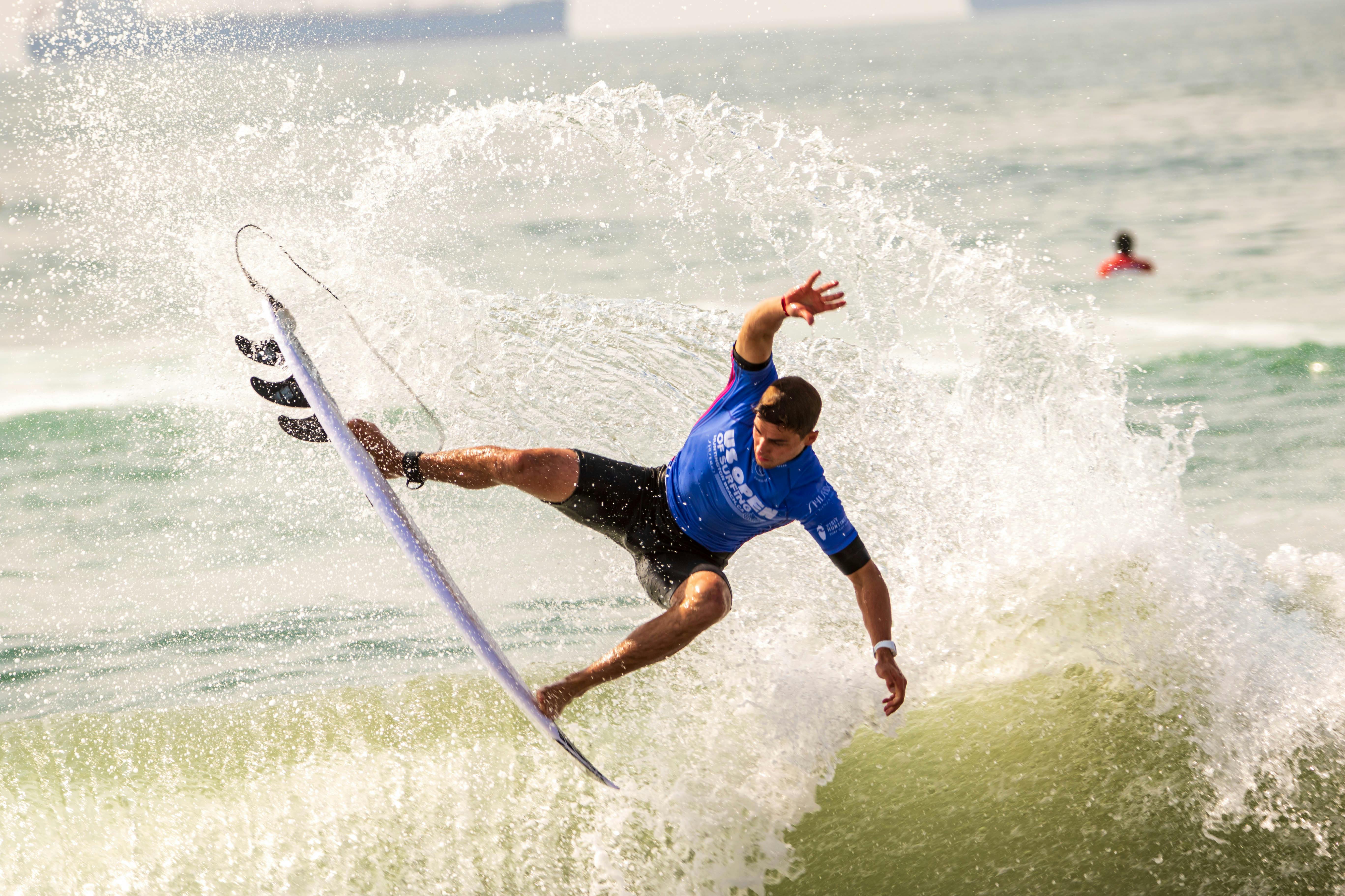 Photo of a Man on a Surfboard · Free Stock Photo