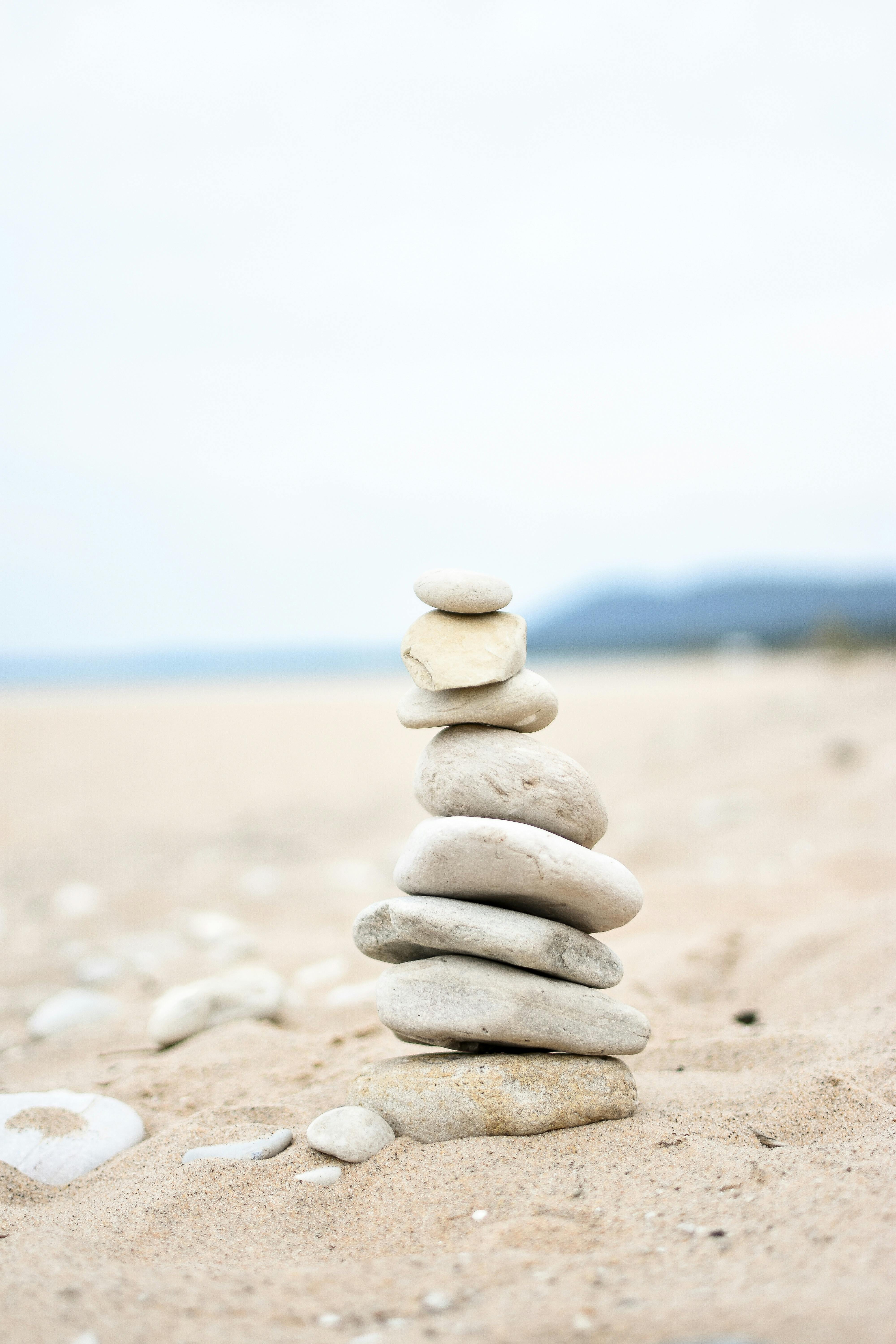 Stack of Gray Stones on Brown Sand · Free Stock Photo