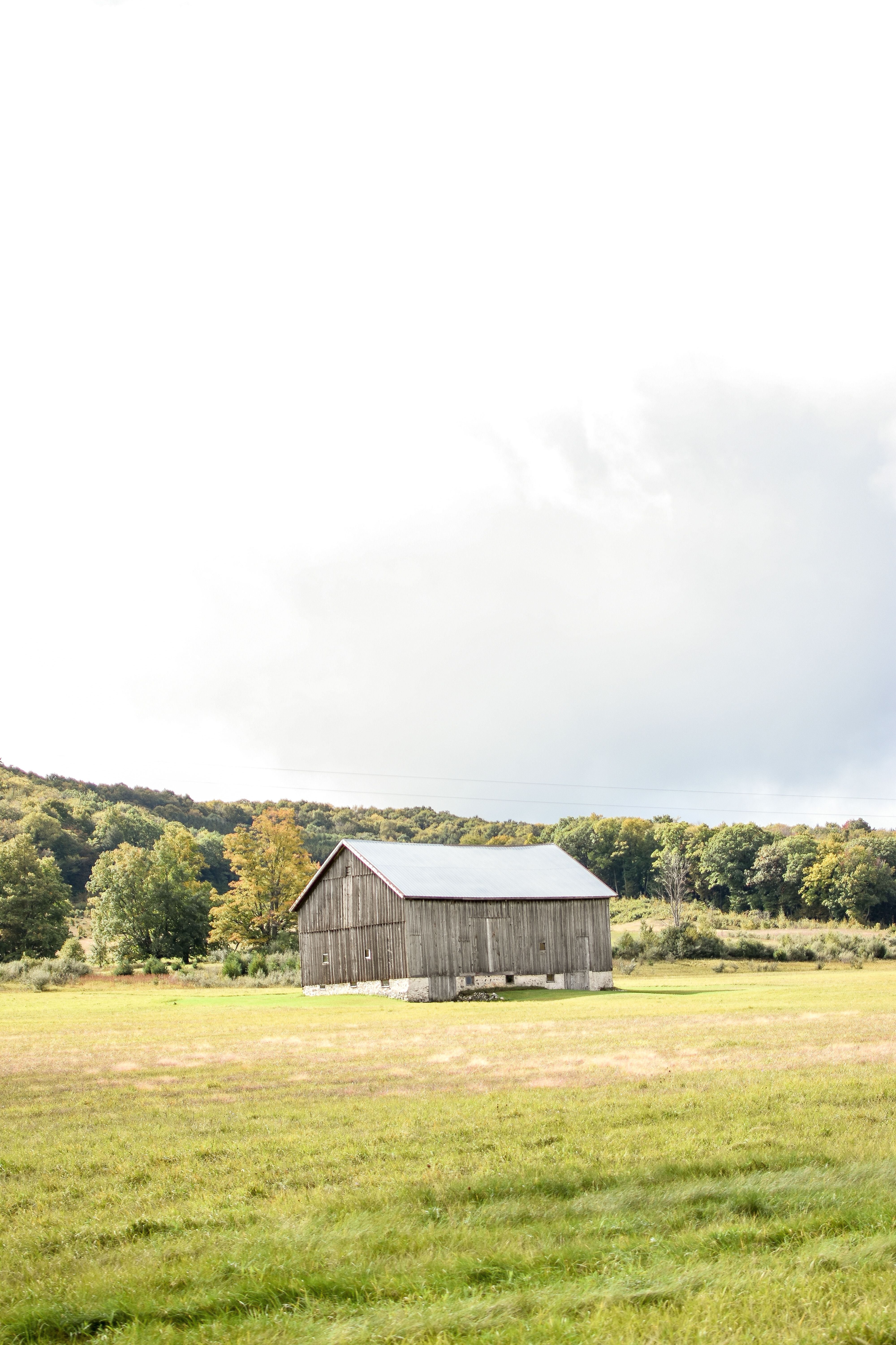Brown Wooden Barn on Green Grass Field · Free Stock Photo