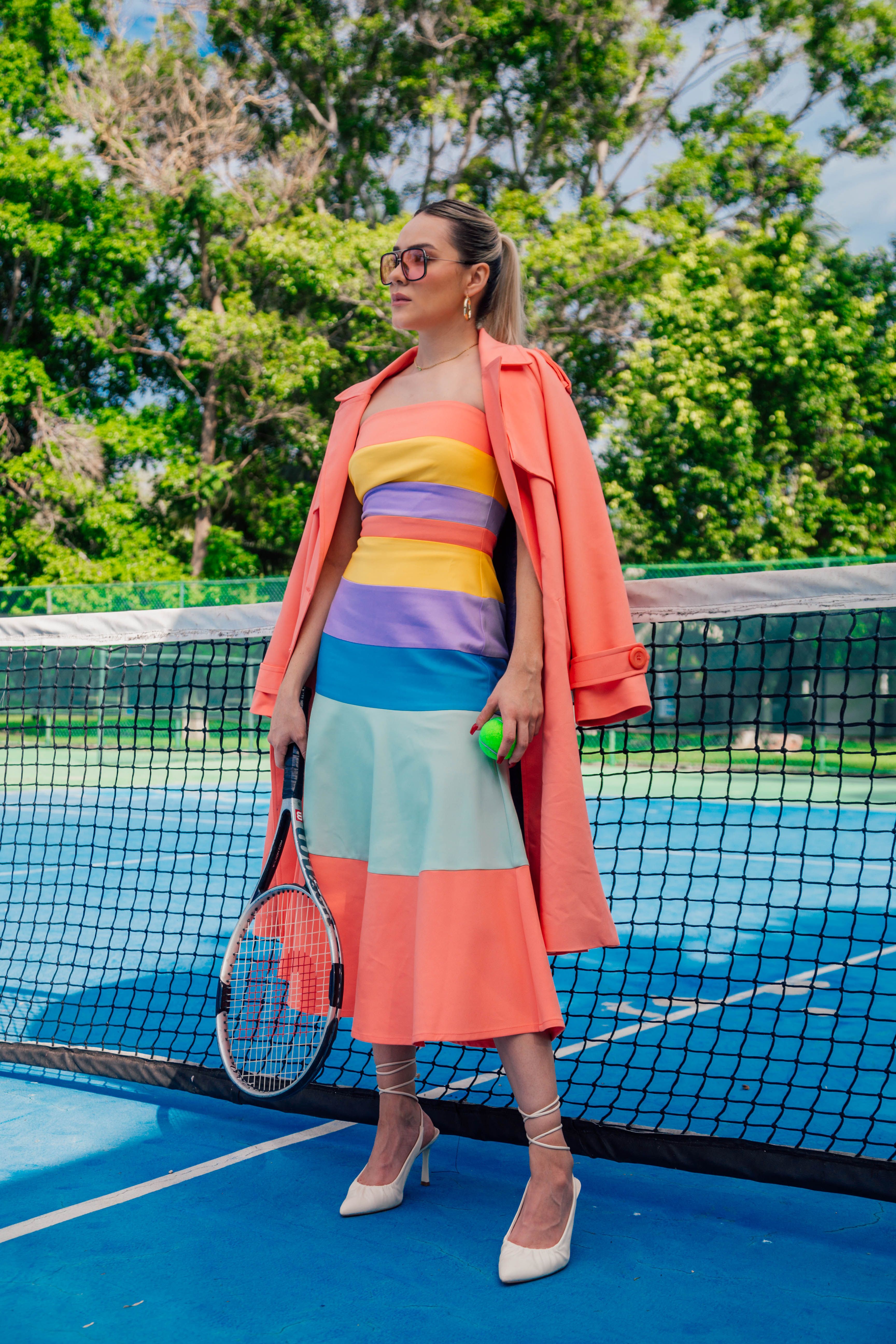 A Female Fashion Model Standing on Tennis Court · Free Stock Photo