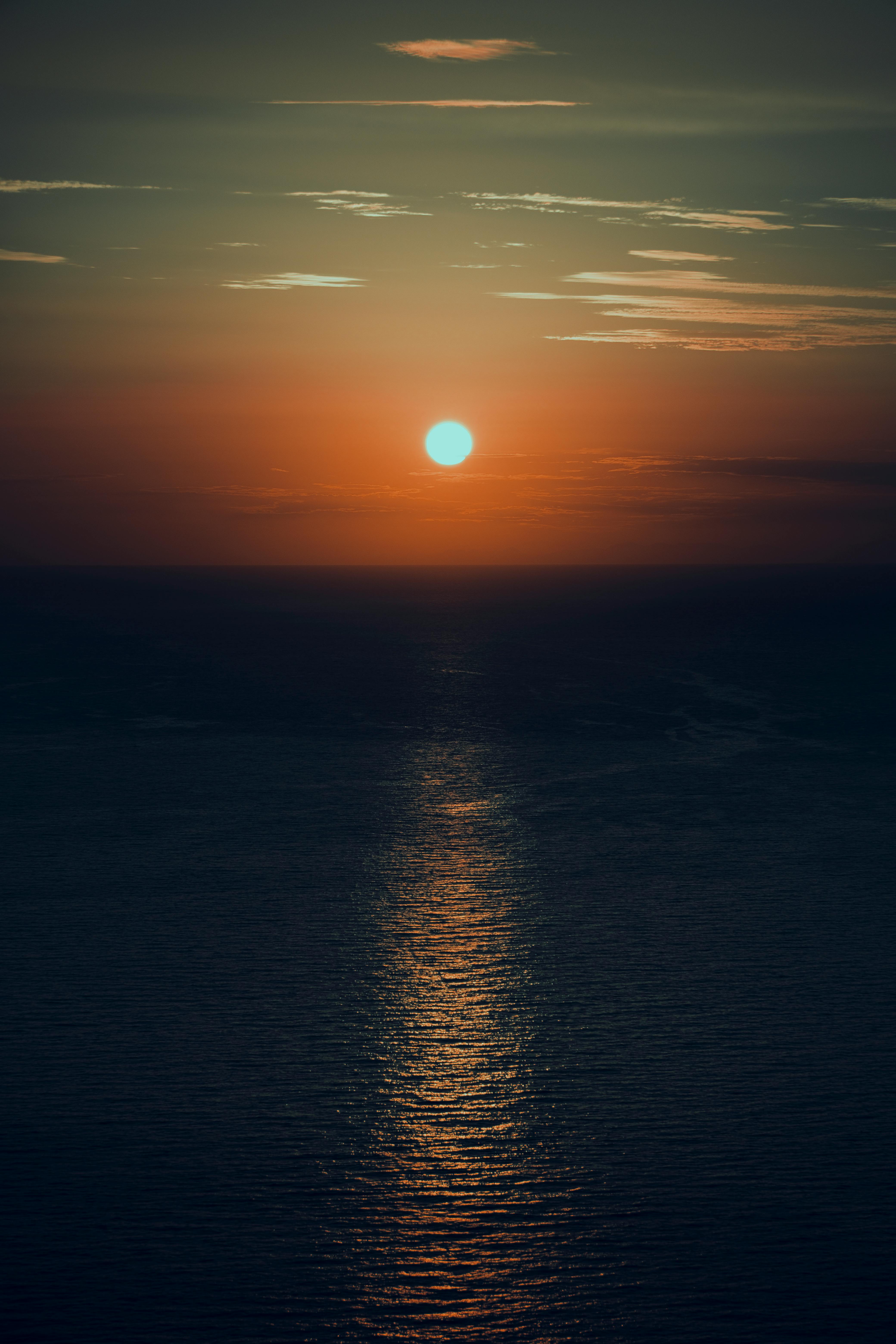 Beautiful Sunset Over Body of Water · Free Stock Photo