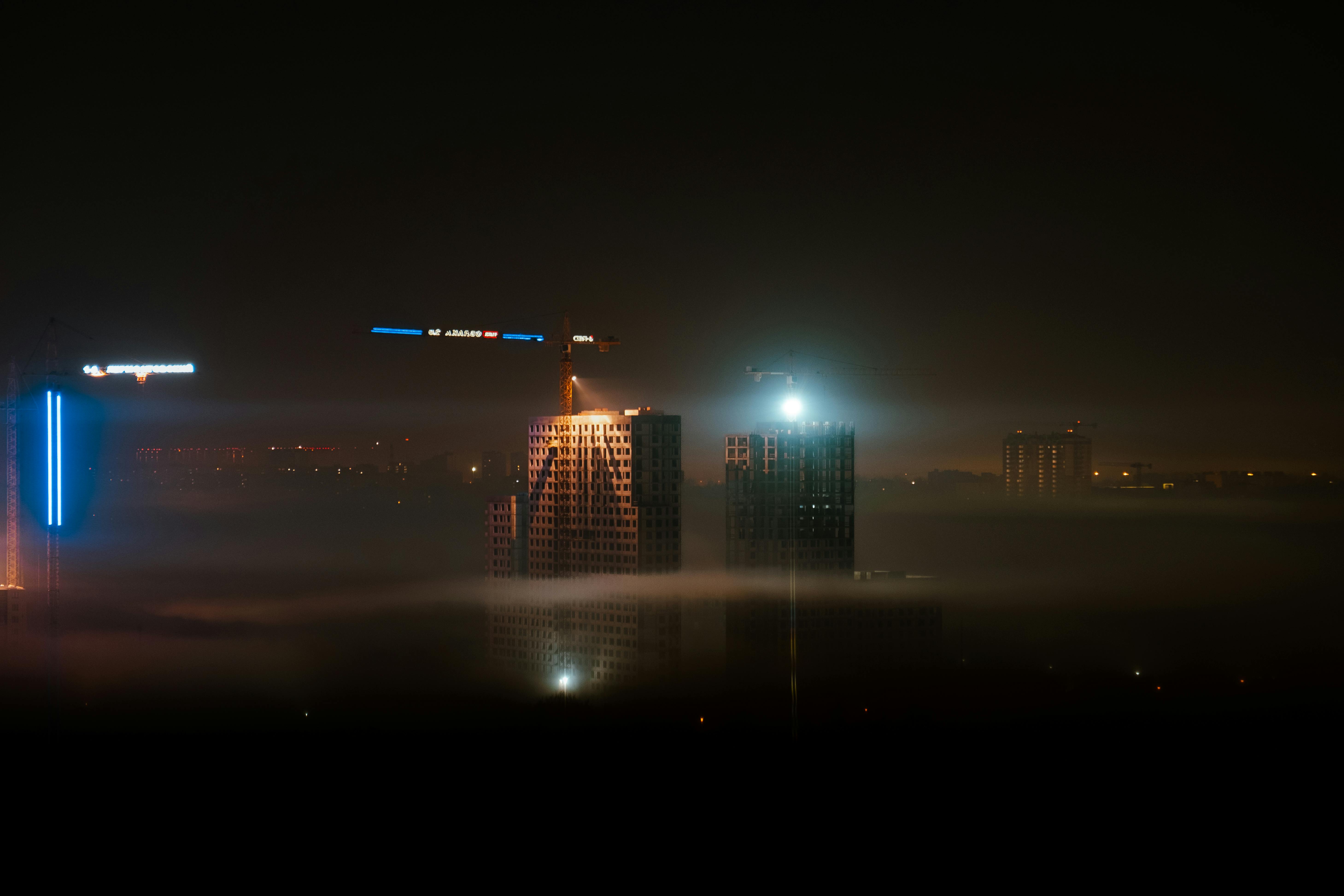 City With High Rise Buildings during Night Time · Free Stock Photo