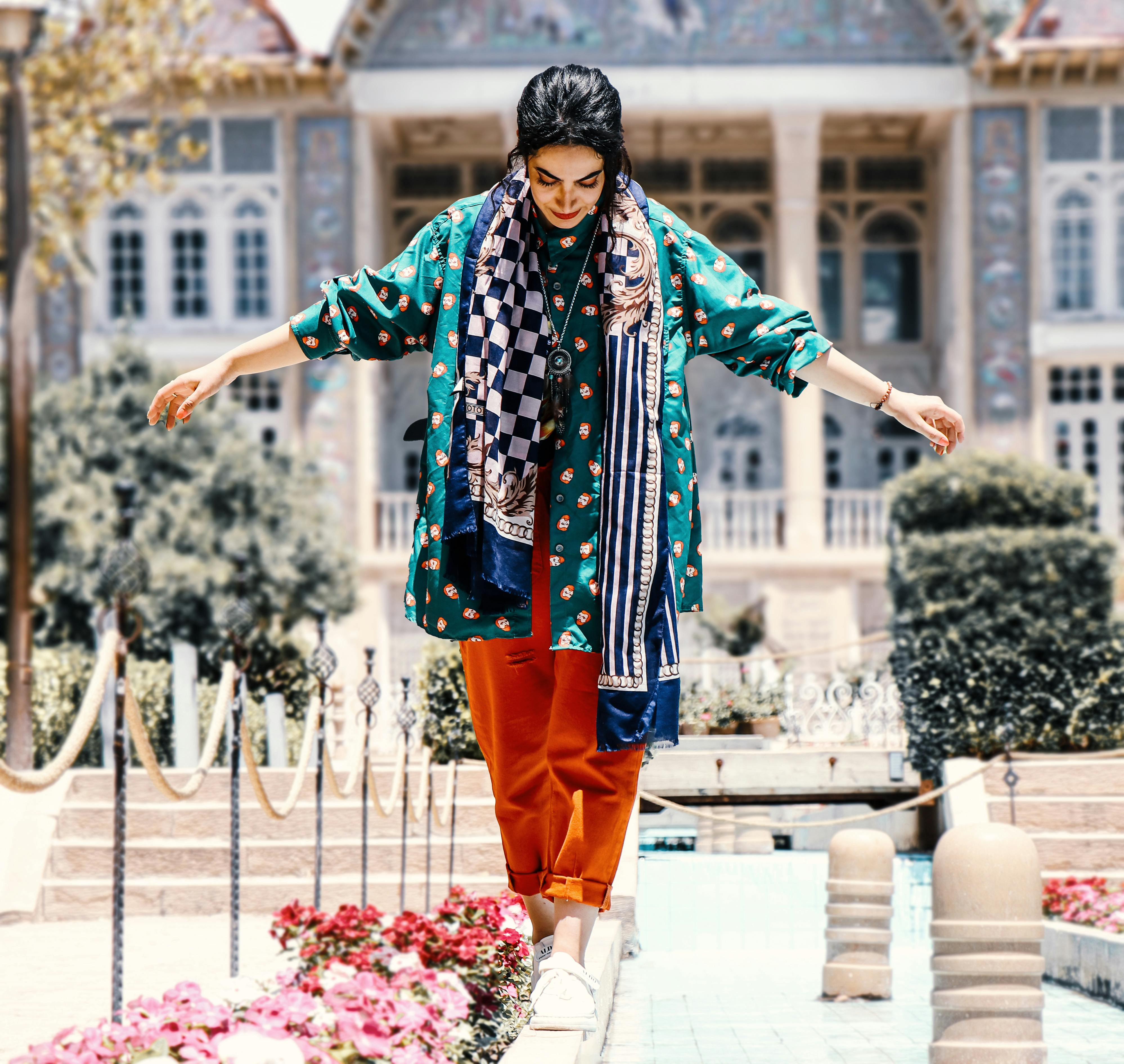 A Person Balancing on a Narrow Ledge · Free Stock Photo