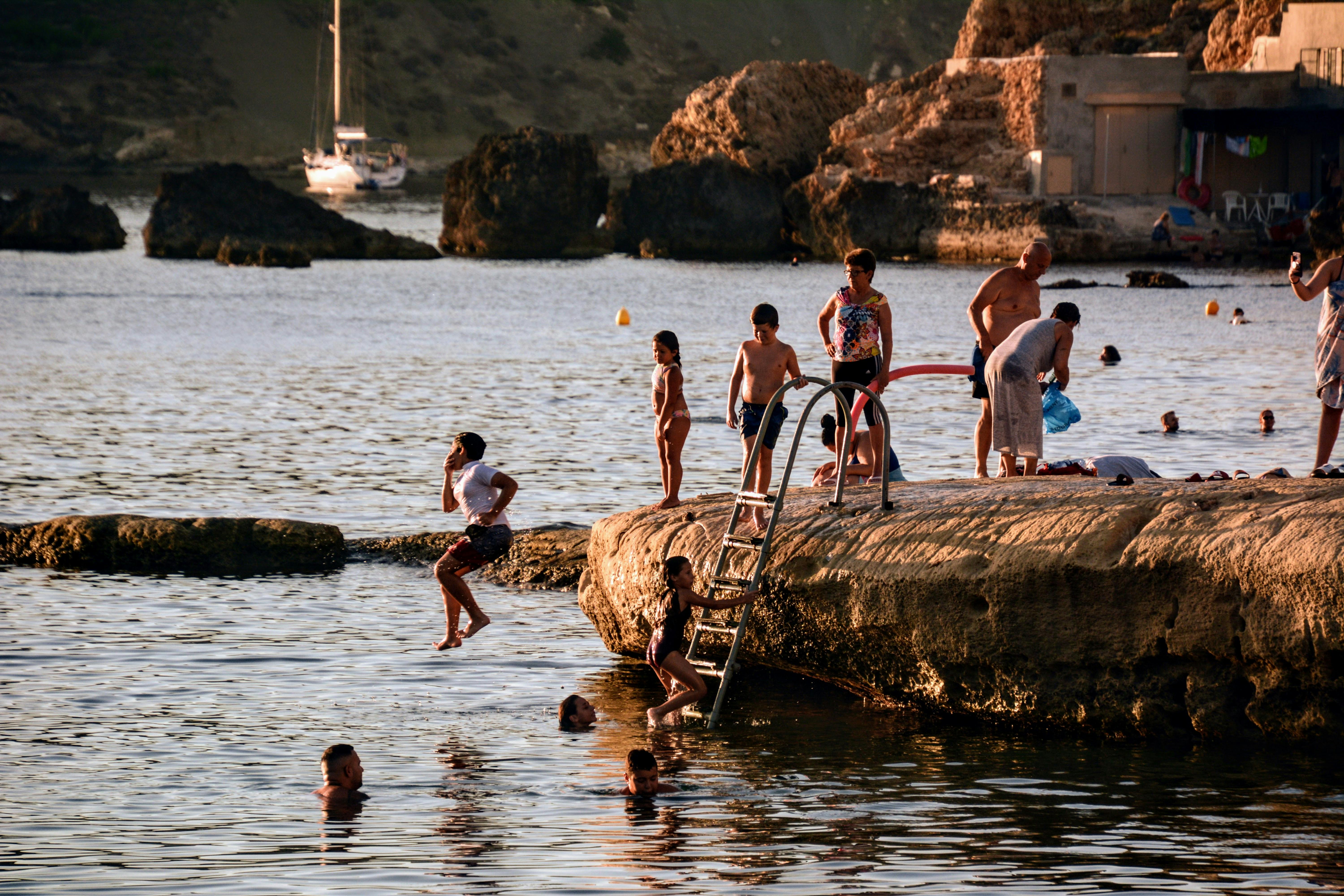 People Swimming in the Ocean · Free Stock Photo