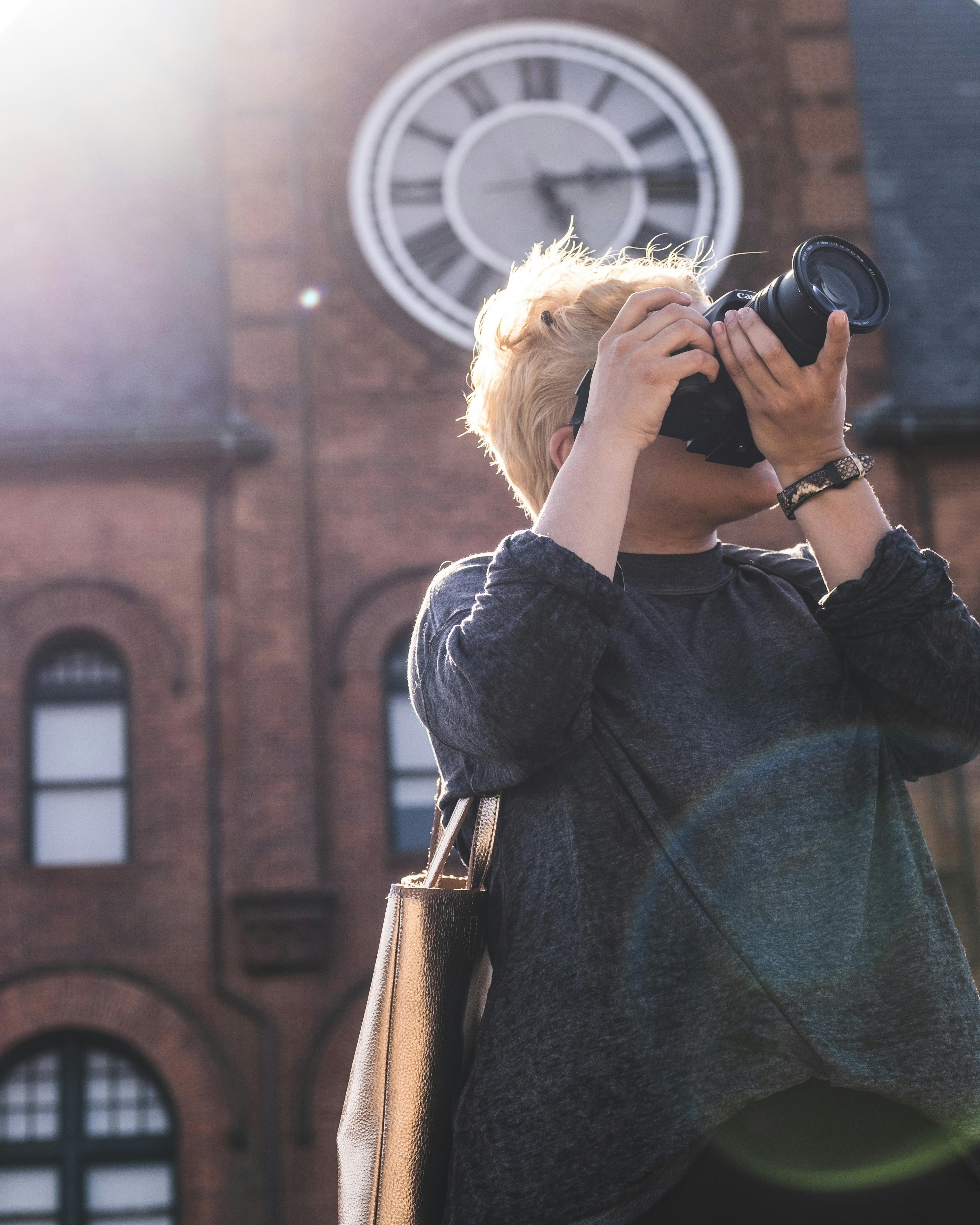 Person Taking a Picture Using DSLR Camera · Free Stock Photo