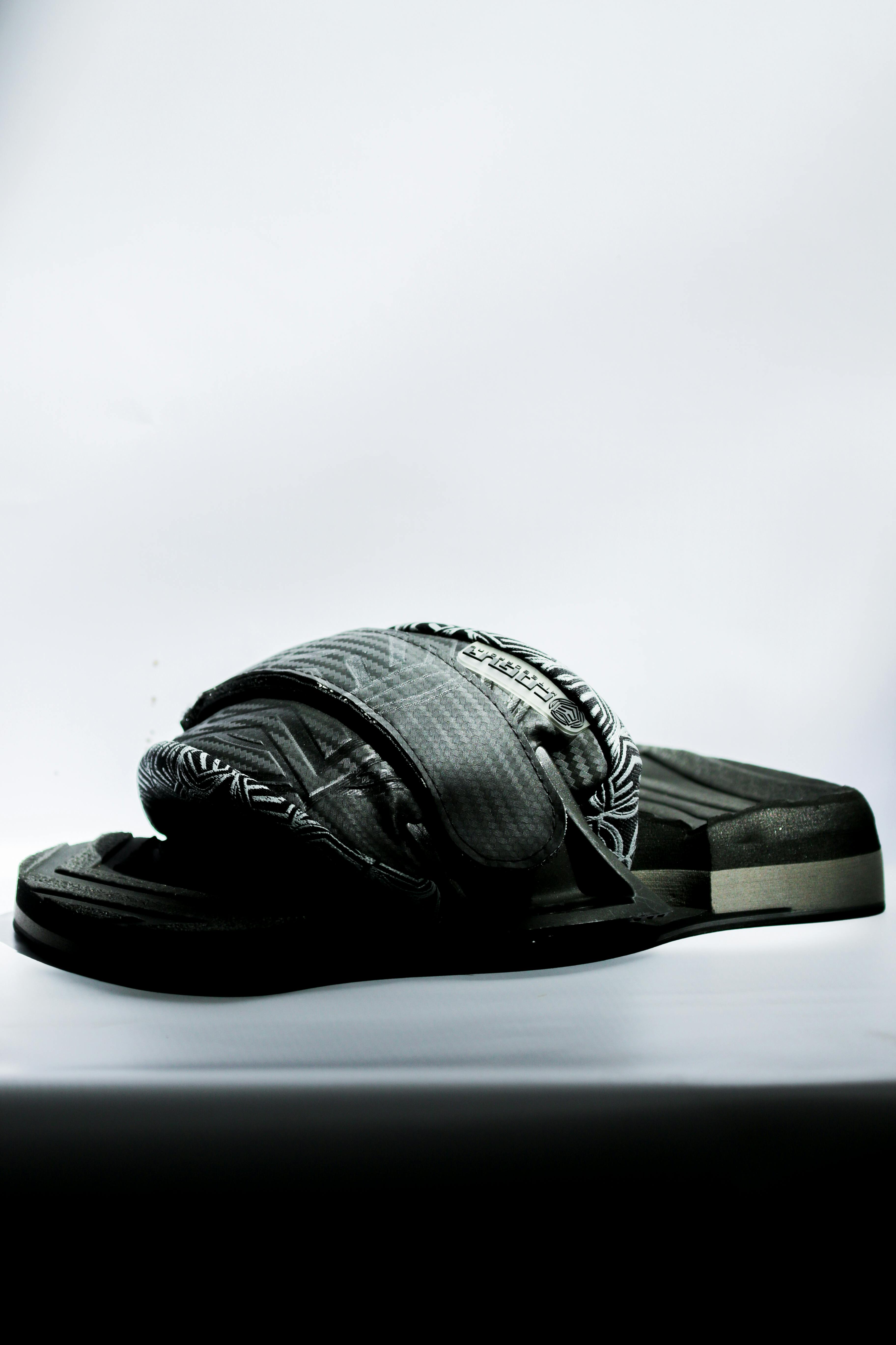 Top View Photo of Slippers On Seashore · Free Stock Photo