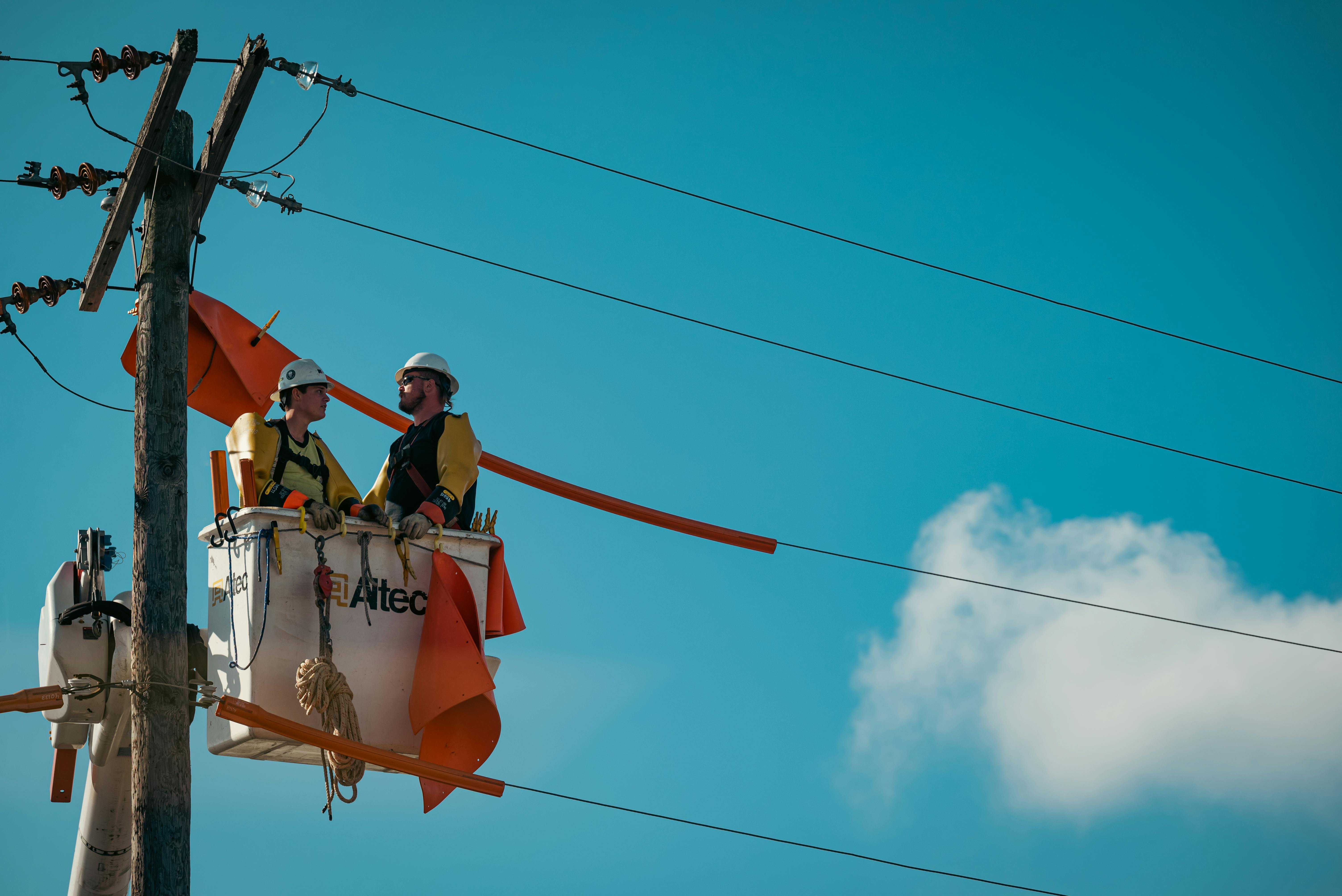 Photography of Man Repairing Electrical Wires · Free Stock Photo