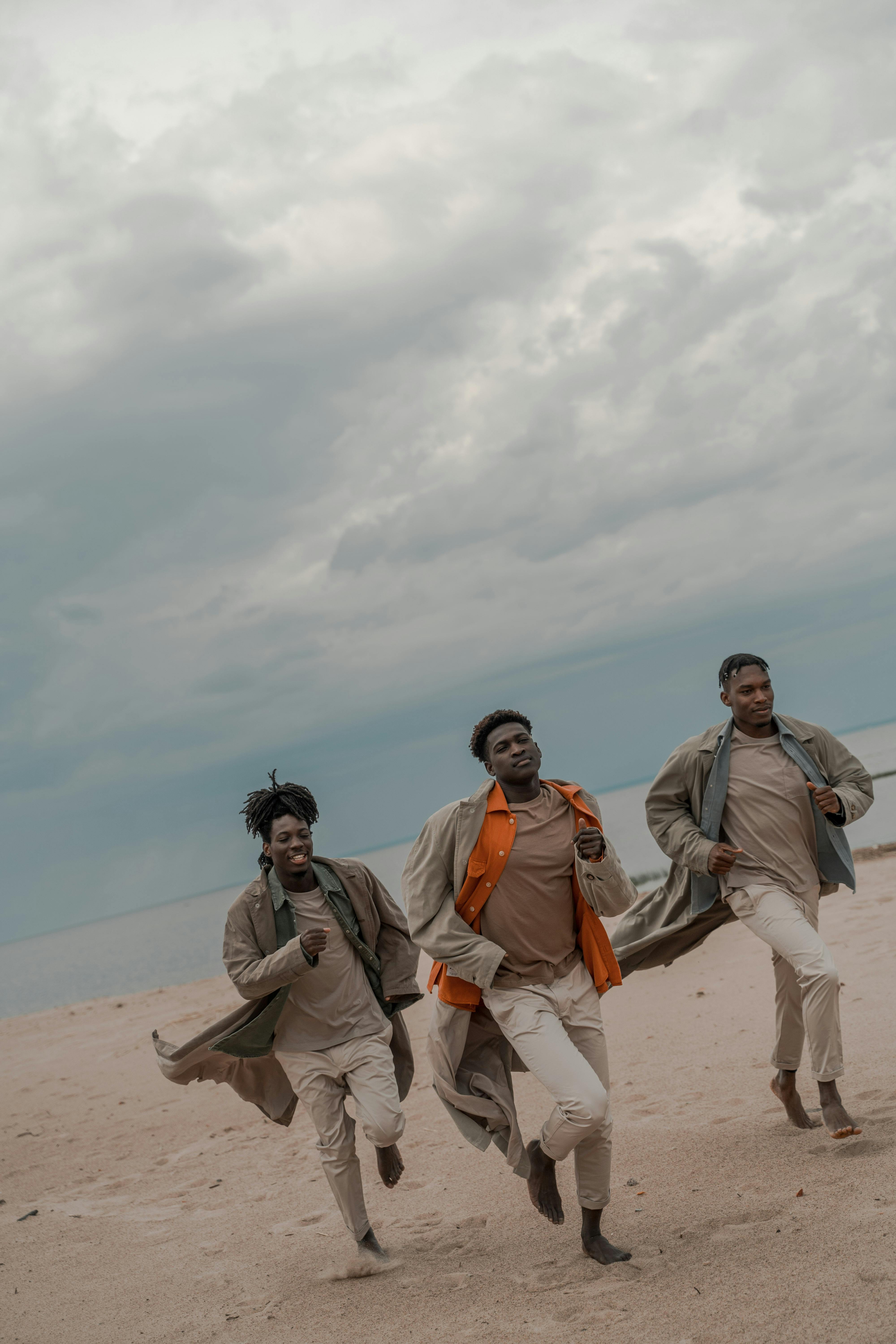 Men in Coats Running · Free Stock Photo