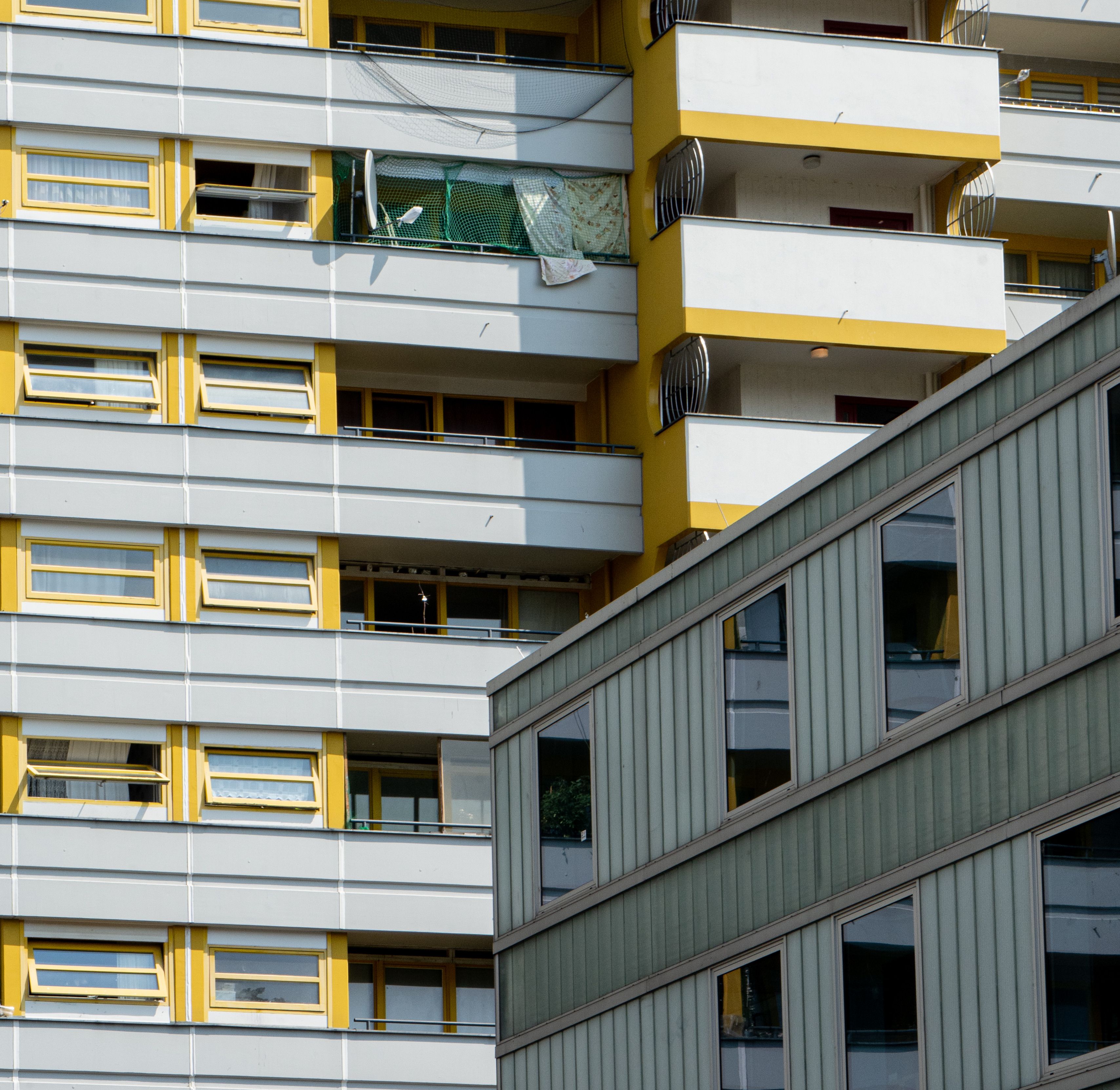 Glass Windows on Gray and Yellow Concrete Building · Free Stock Photo