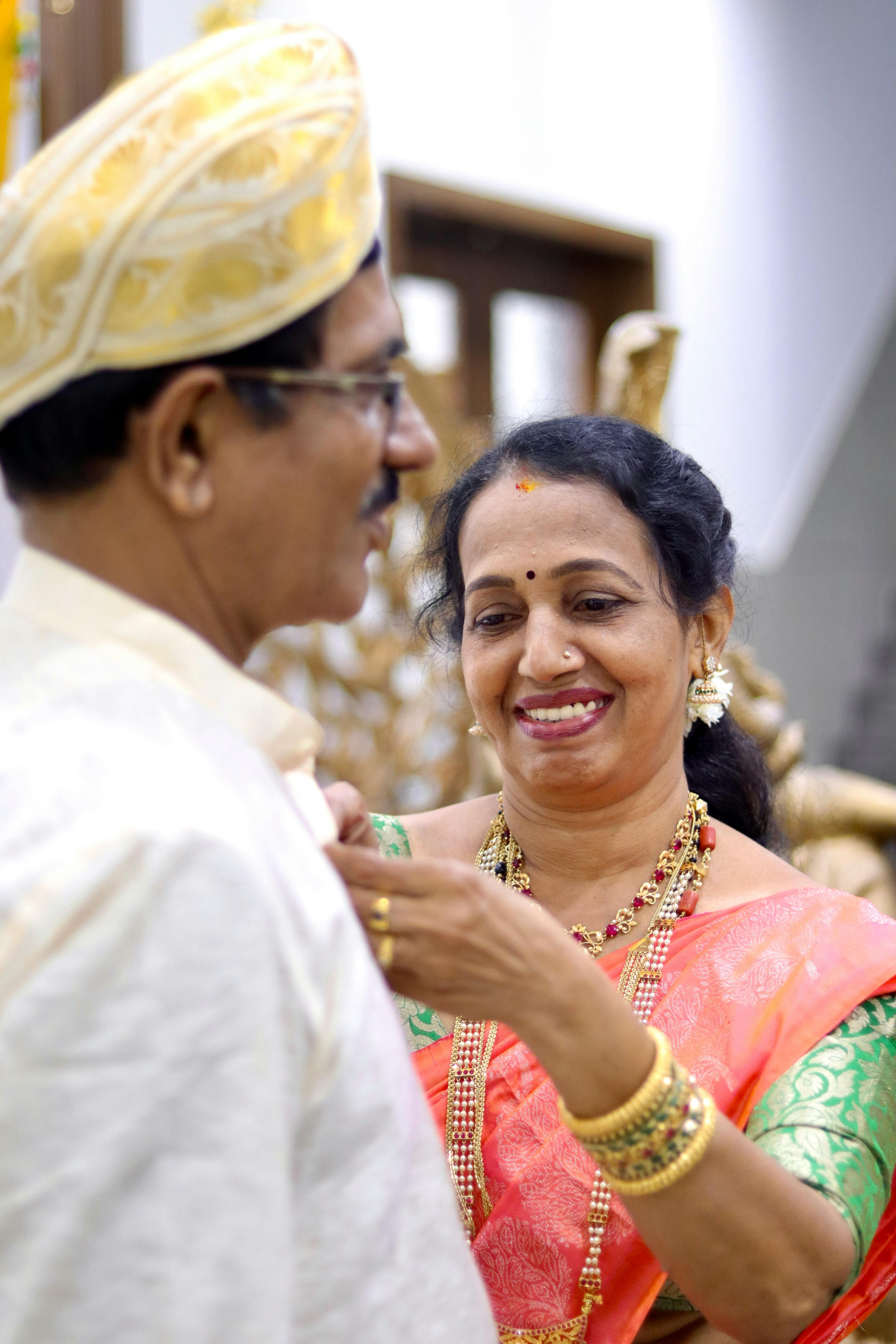Groom Shaking Hands with a Guest · Free Stock Photo