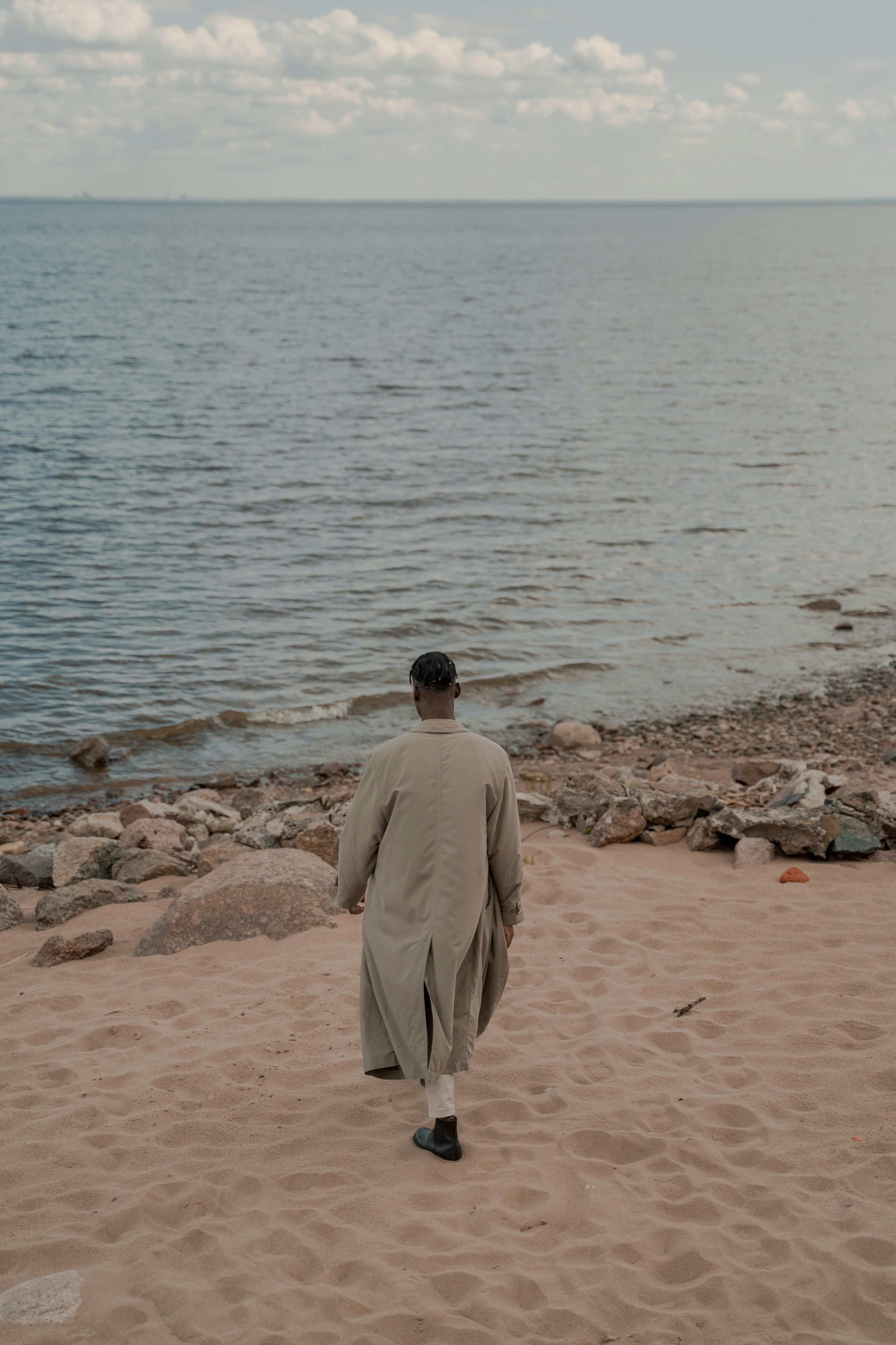 Man Walking Towards Sea · Free Stock Photo