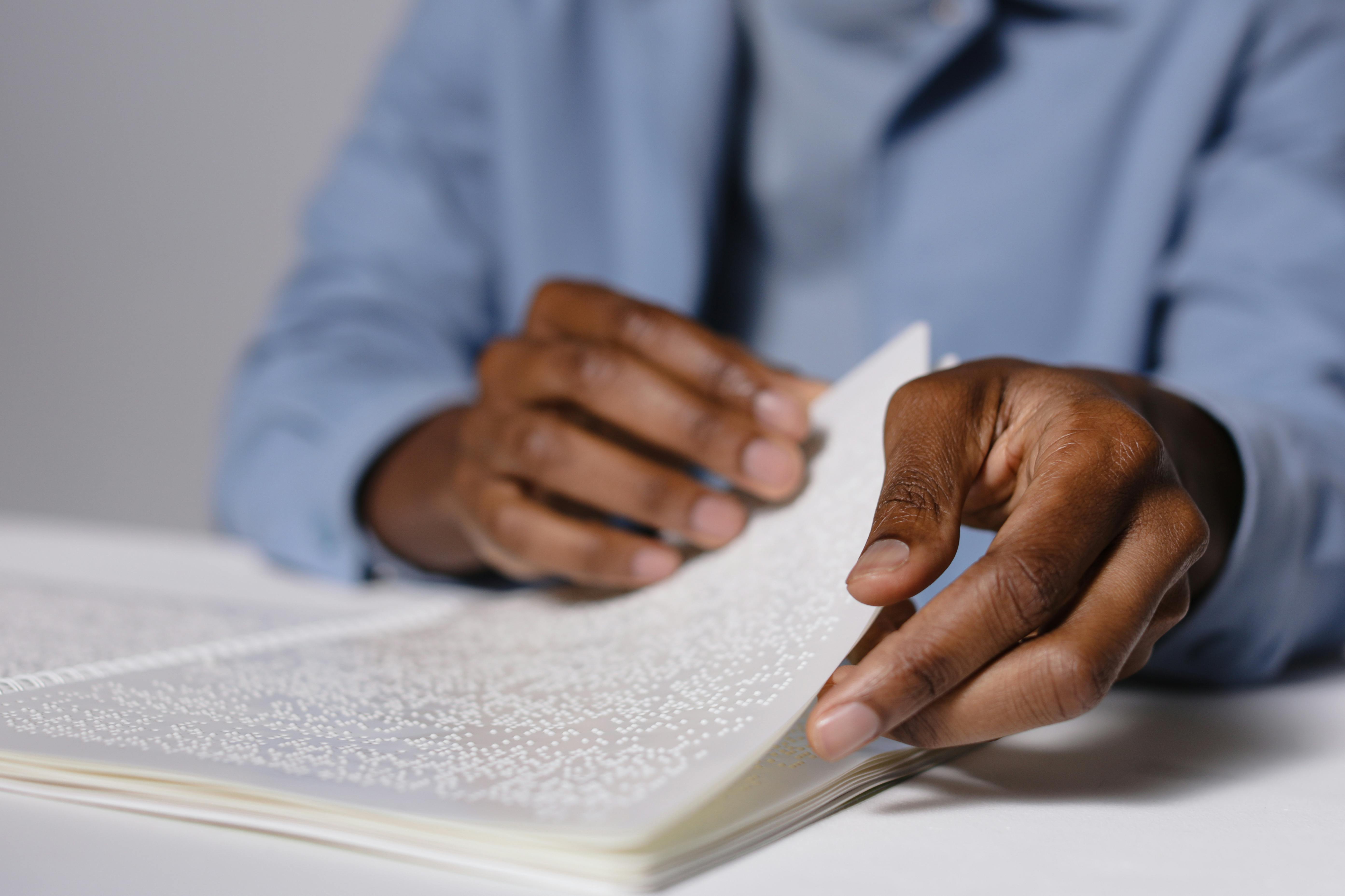 Hands Turning the Pages of a Book · Free Stock Photo