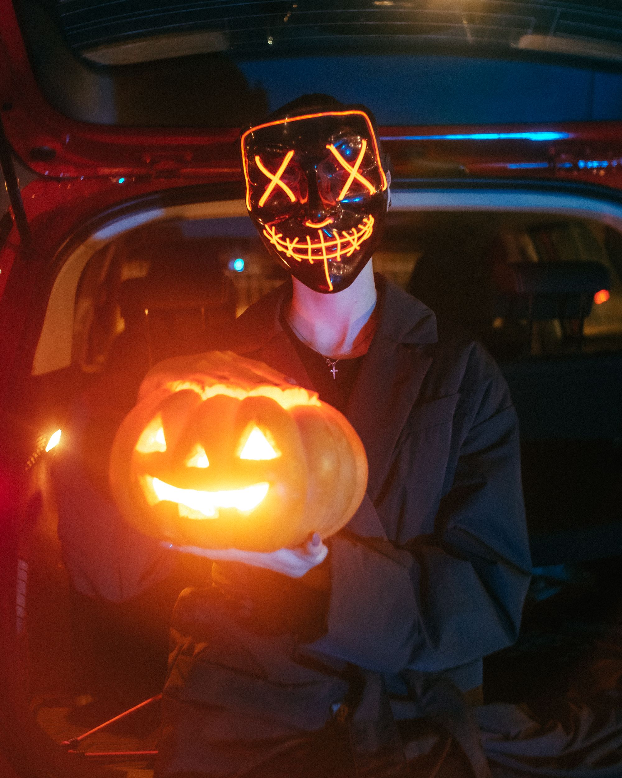 Man Wearing Halloween Mask and Holding Illuminated Pumpkin · Free Stock ...