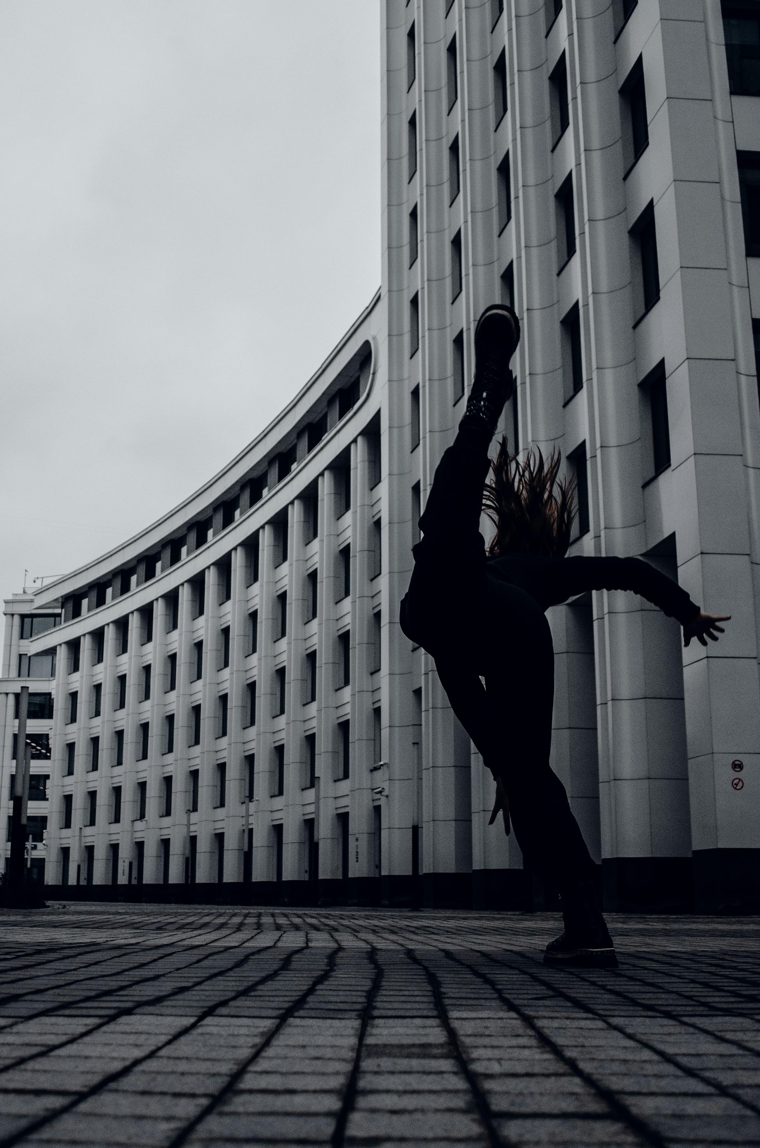 Woman Tripping in front of Building · Free Stock Photo