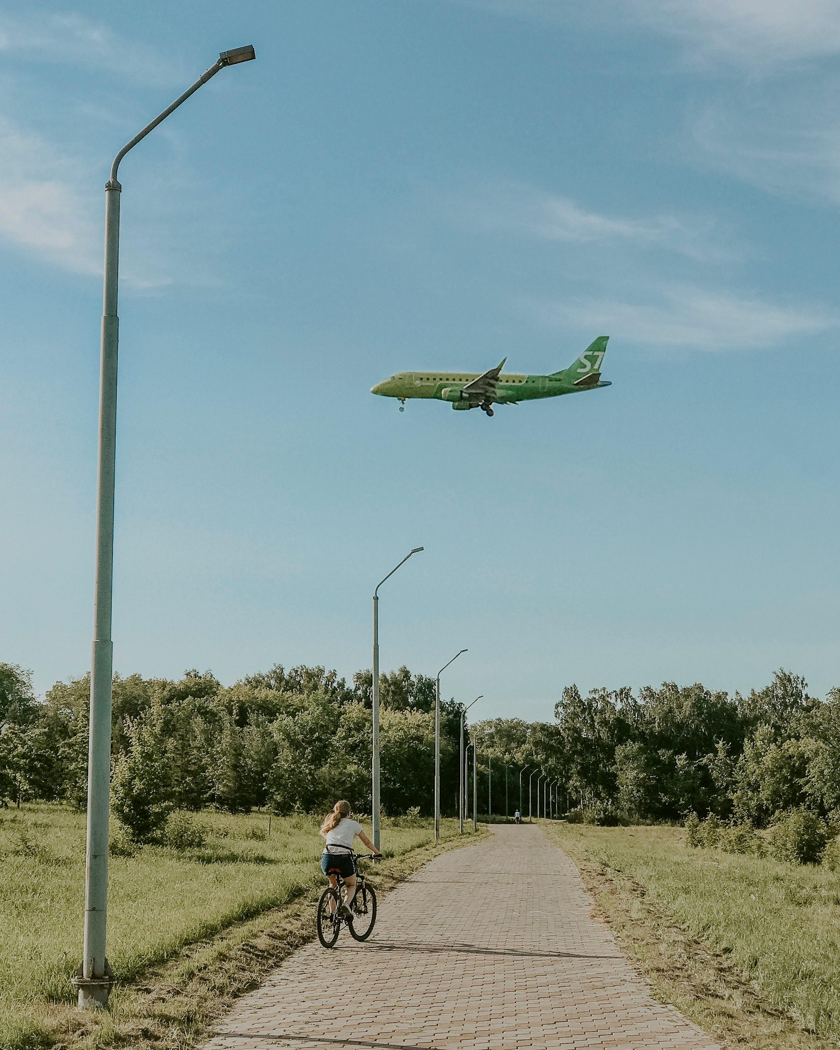 Airplane Flying Over a Pavement · Free Stock Photo