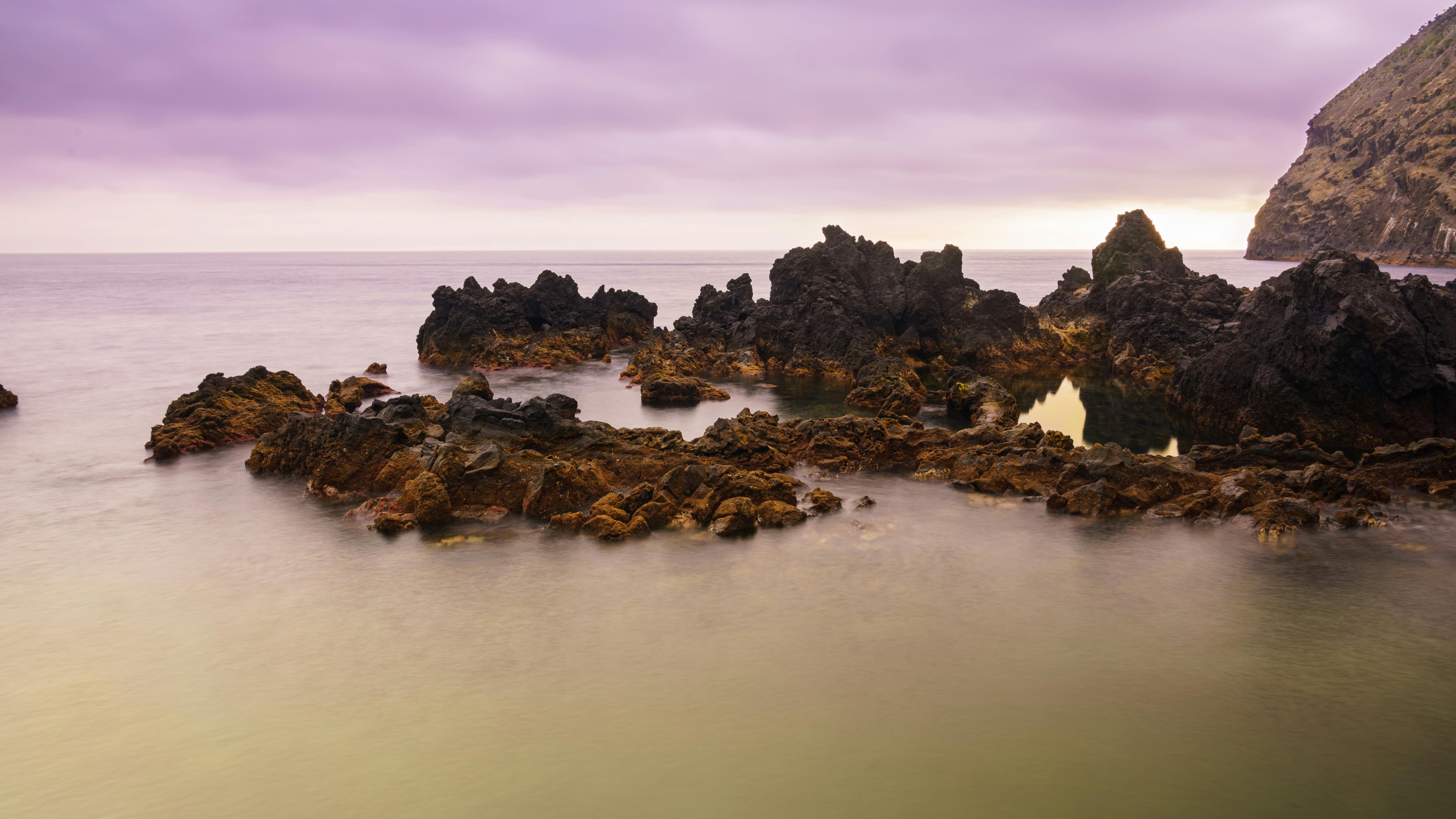 Rock Formation on Sea during Dawn · Free Stock Photo