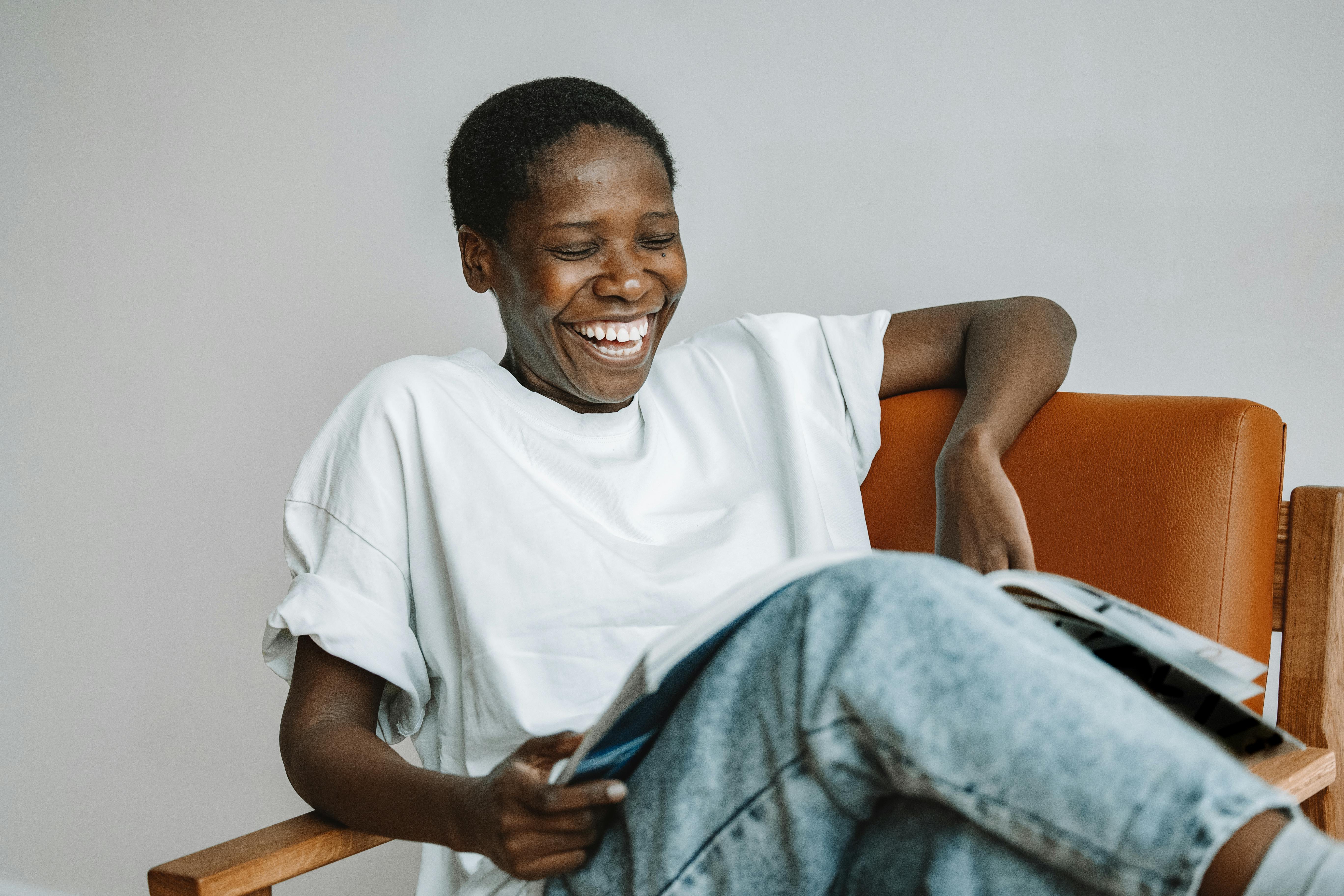 Person Sitting In Chair Laughing Photos, Download The BEST Free Person ...