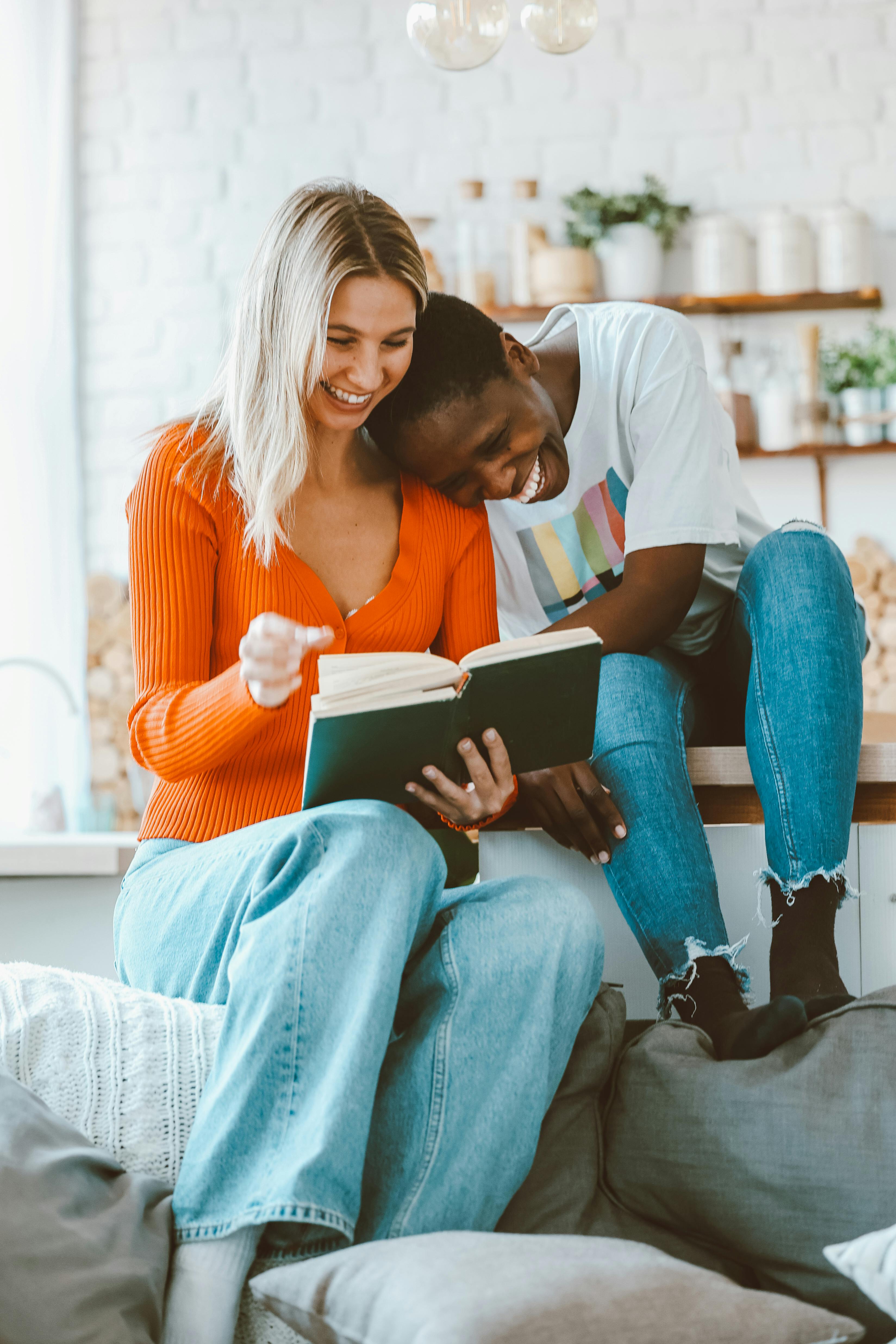 Happy Friends Reading a Book Together · Free Stock Photo