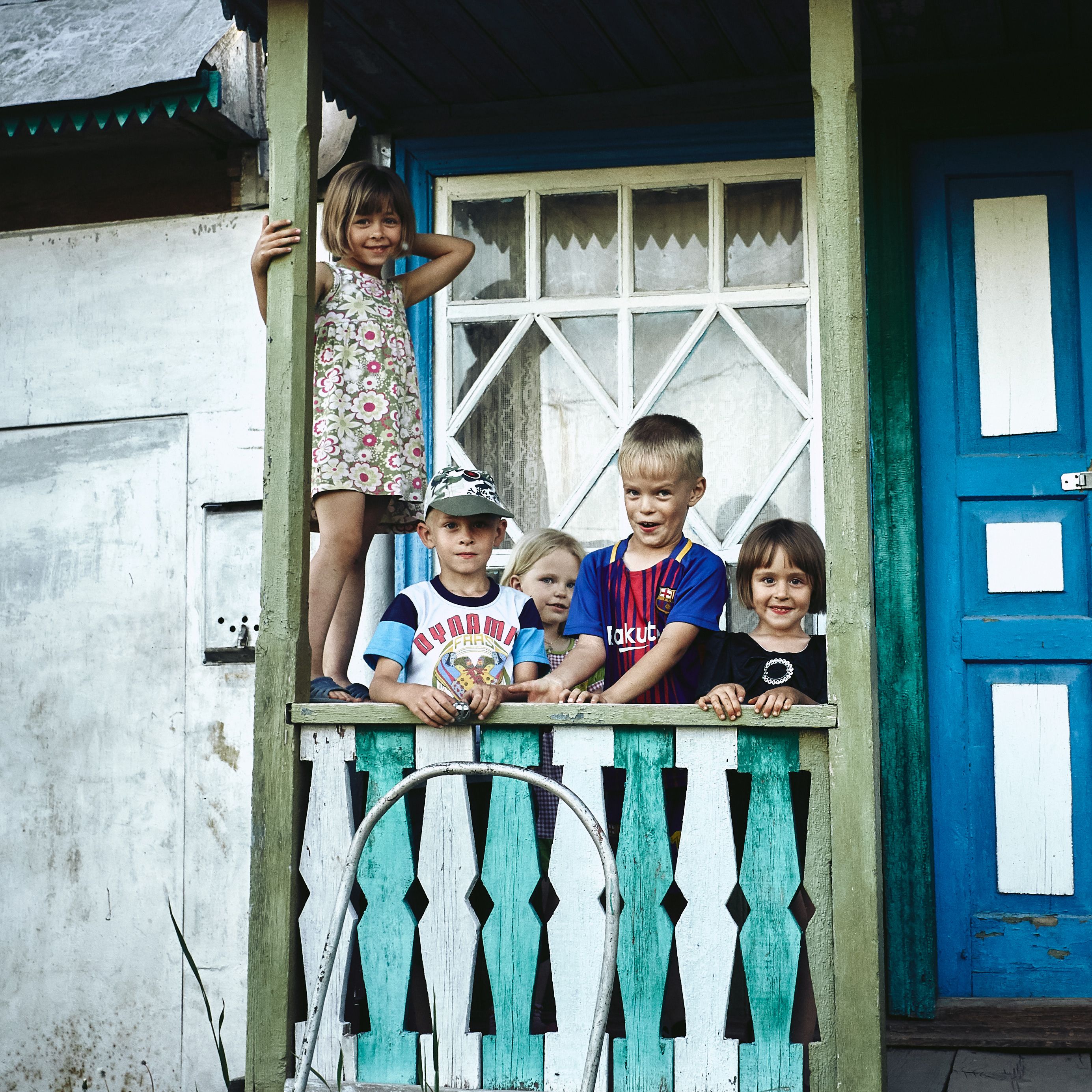A Group of Children Standing Behind a Wooden Fence · Free Stock Photo