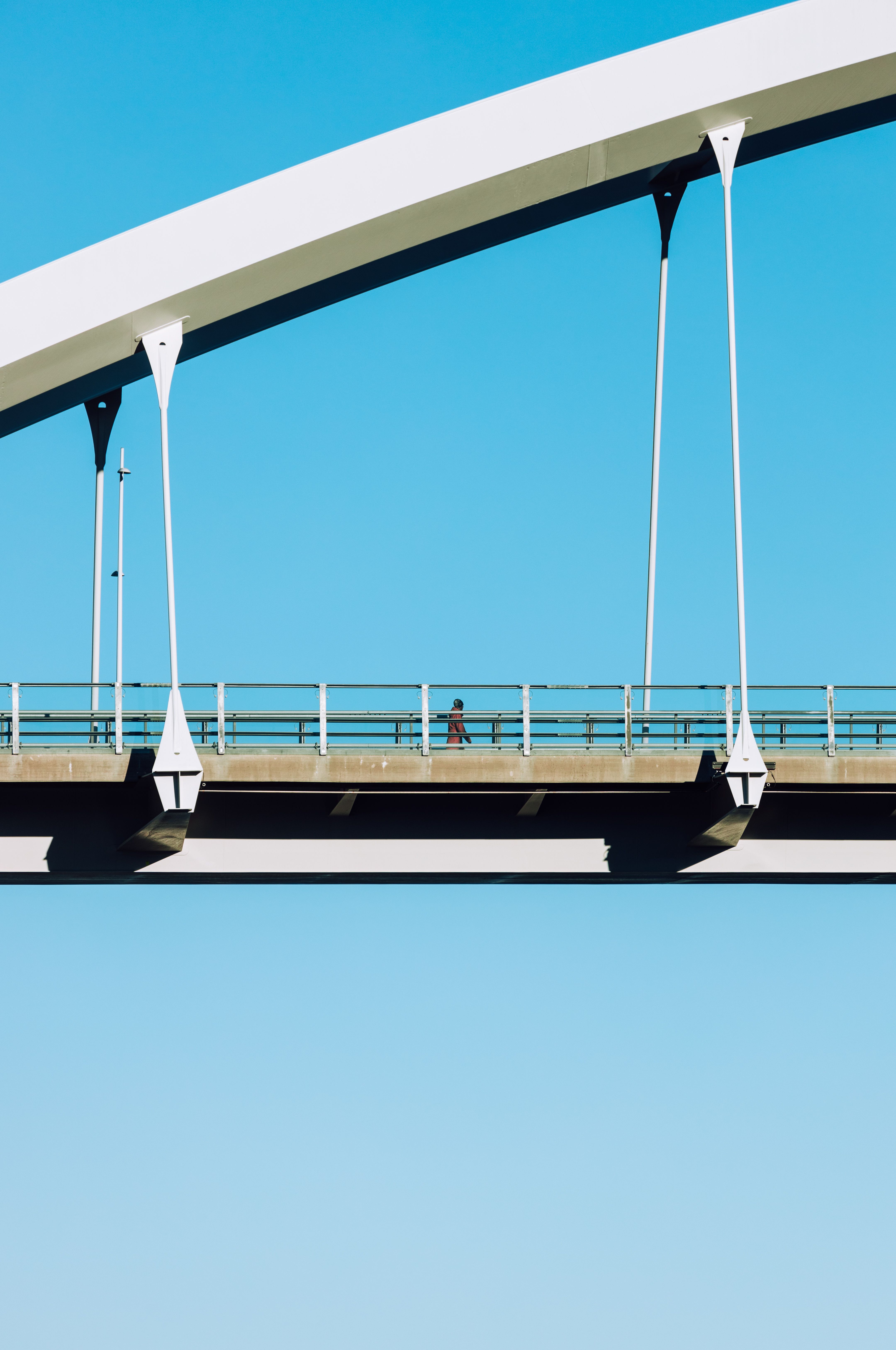 Person Walking on White Bridge · Free Stock Photo