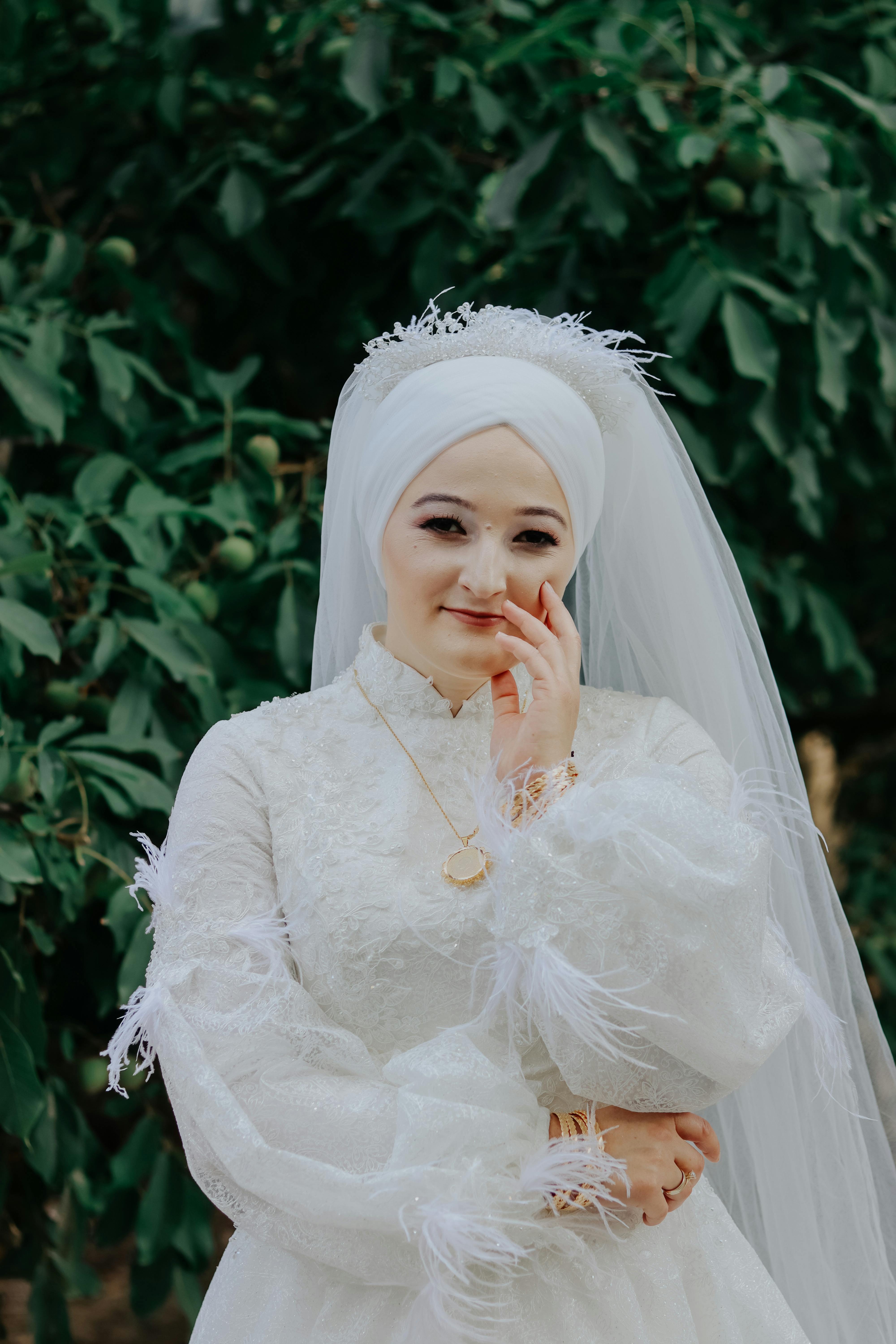 Bride Holding Her Veil on a Car Hood · Free Stock Photo